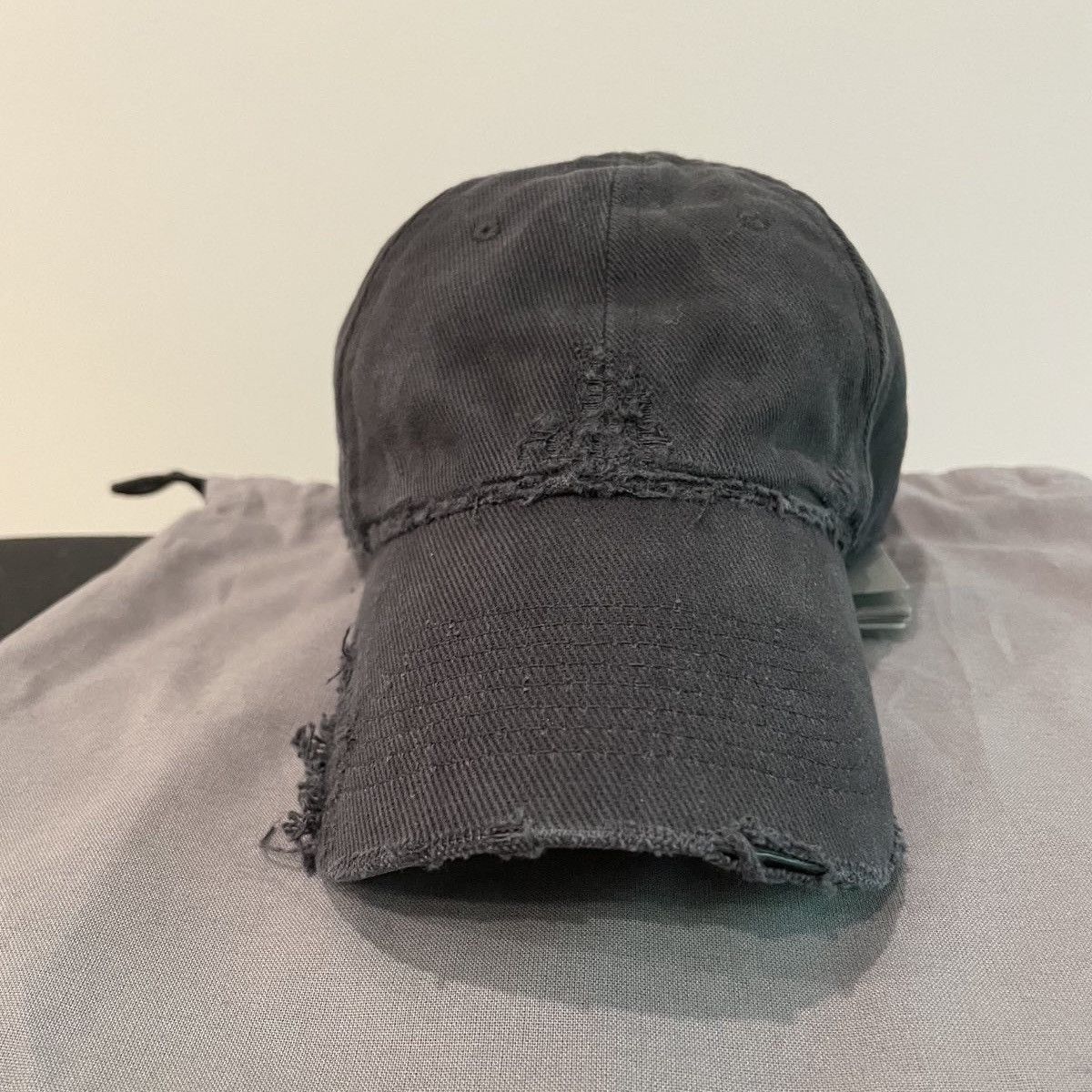 Balenciaga BALENCIAGA DOG BITE DISTRESSED CAP | Grailed