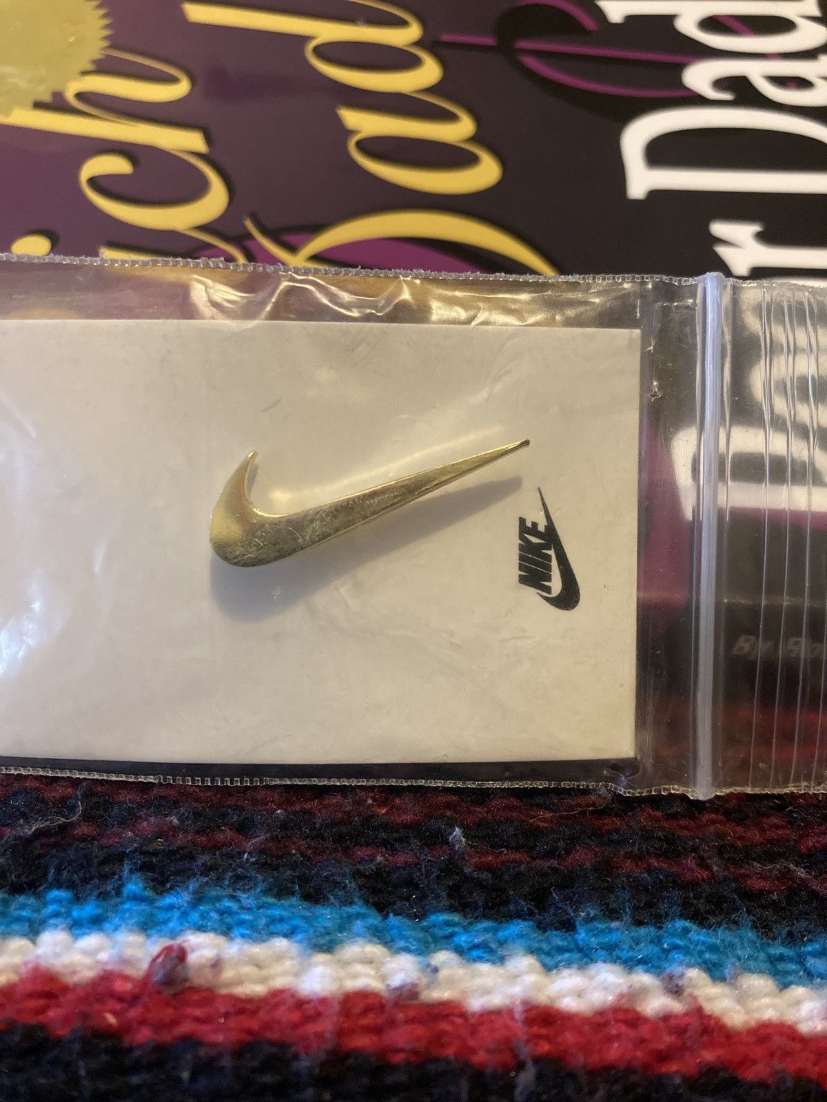 Nike NIKE Gold Swoosh Pin | Grailed