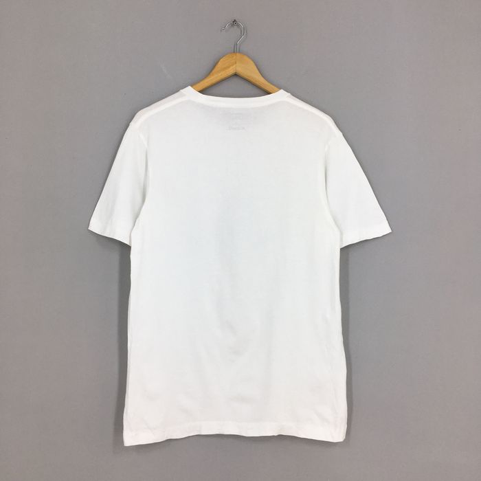 Uniqlo Uniqlo X Kaws Original Fake White Tshirt Size M | Grailed