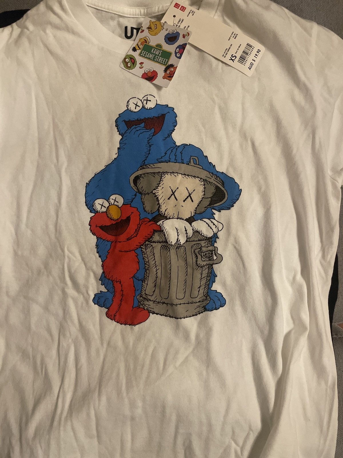Kaws × Uniqlo Kaws x Uniqlo x Sesame Street companion trash can tee ...
