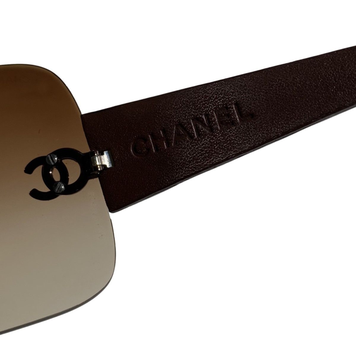 Chanel × Vintage Chanel Brown Leather Quilted Shield Rimless Sunglasses ...
