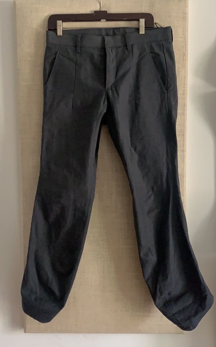 Julius DEVOA japan, twisted curve, “cutout” back hem pants | Grailed