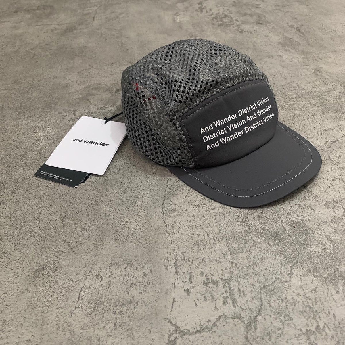 And Wander District Vision x And Wander Logo-Print Mesh and Pertex | Grailed