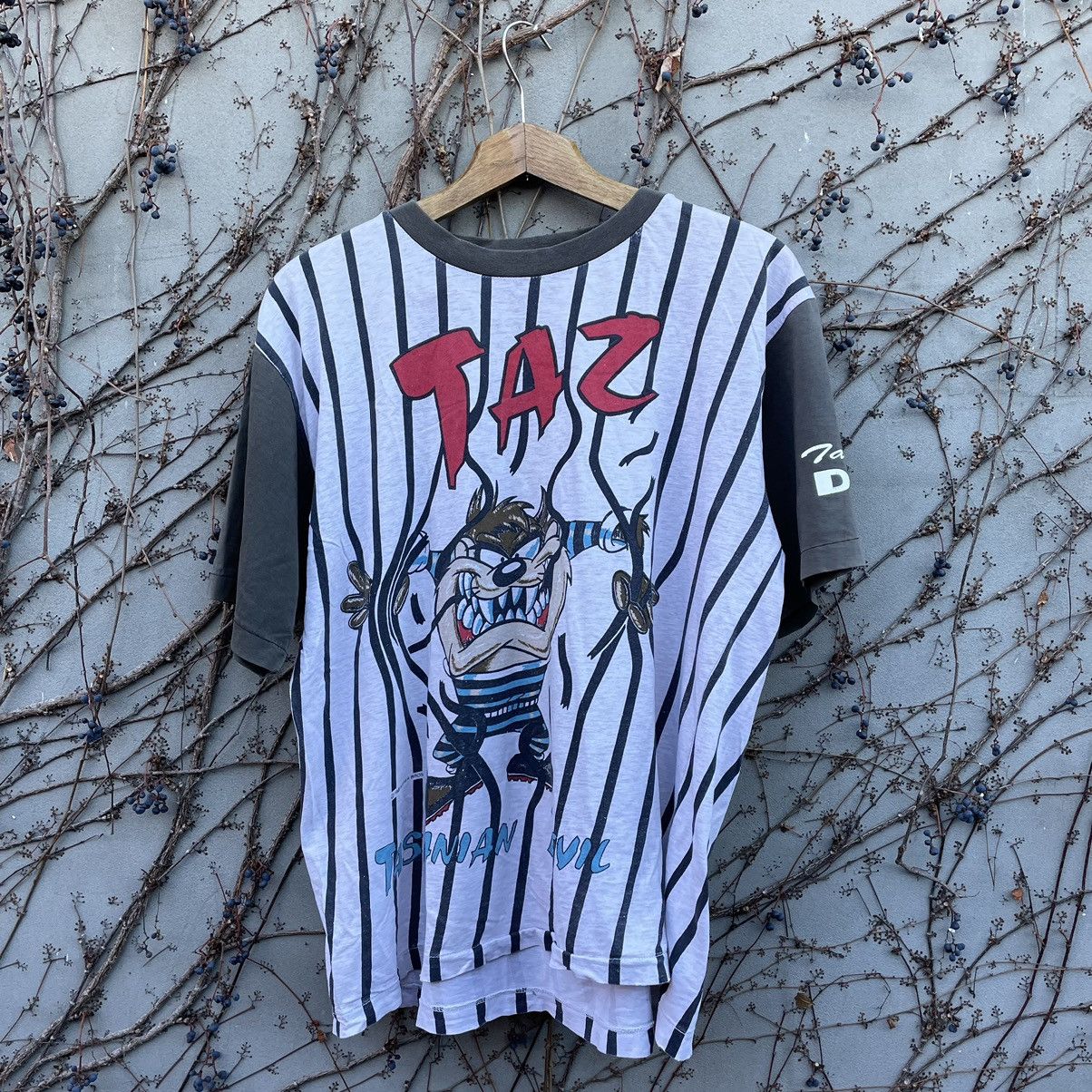 Vintage Vintage 1995 Taz Prisoner Allover Print Distressed T-Shirt ...
