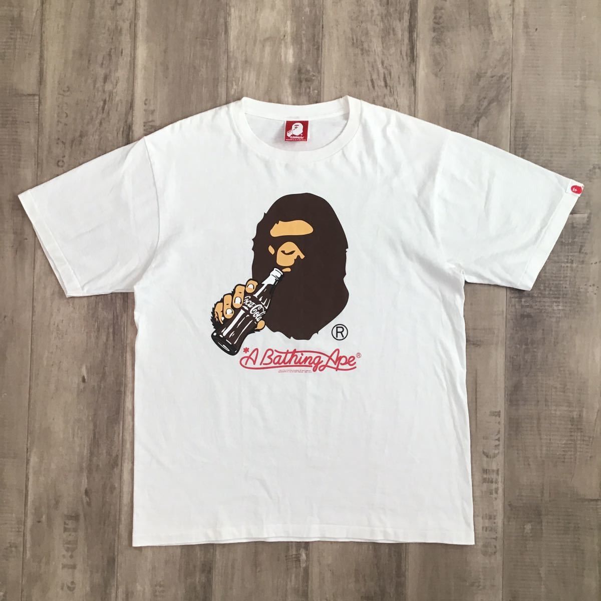 Bape BAPE × Coca-Cola big head T-shirt a bathing ape | Grailed