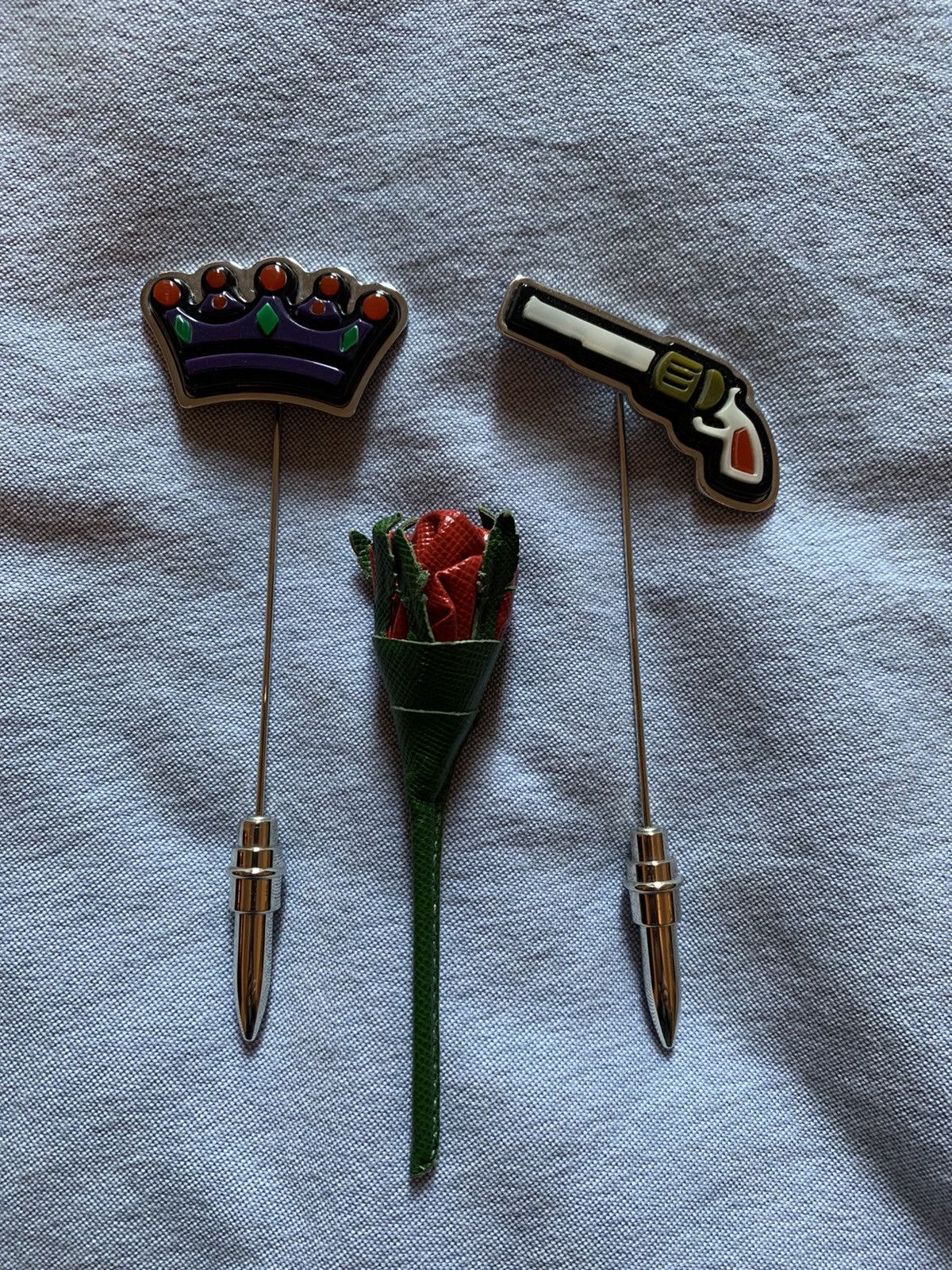 Prada Prada pistol, crown & rose pin | Grailed