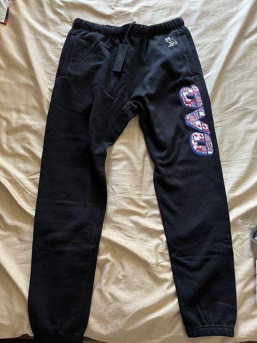 Octobers Very Own OVO flag runner sweatpants black | Grailed