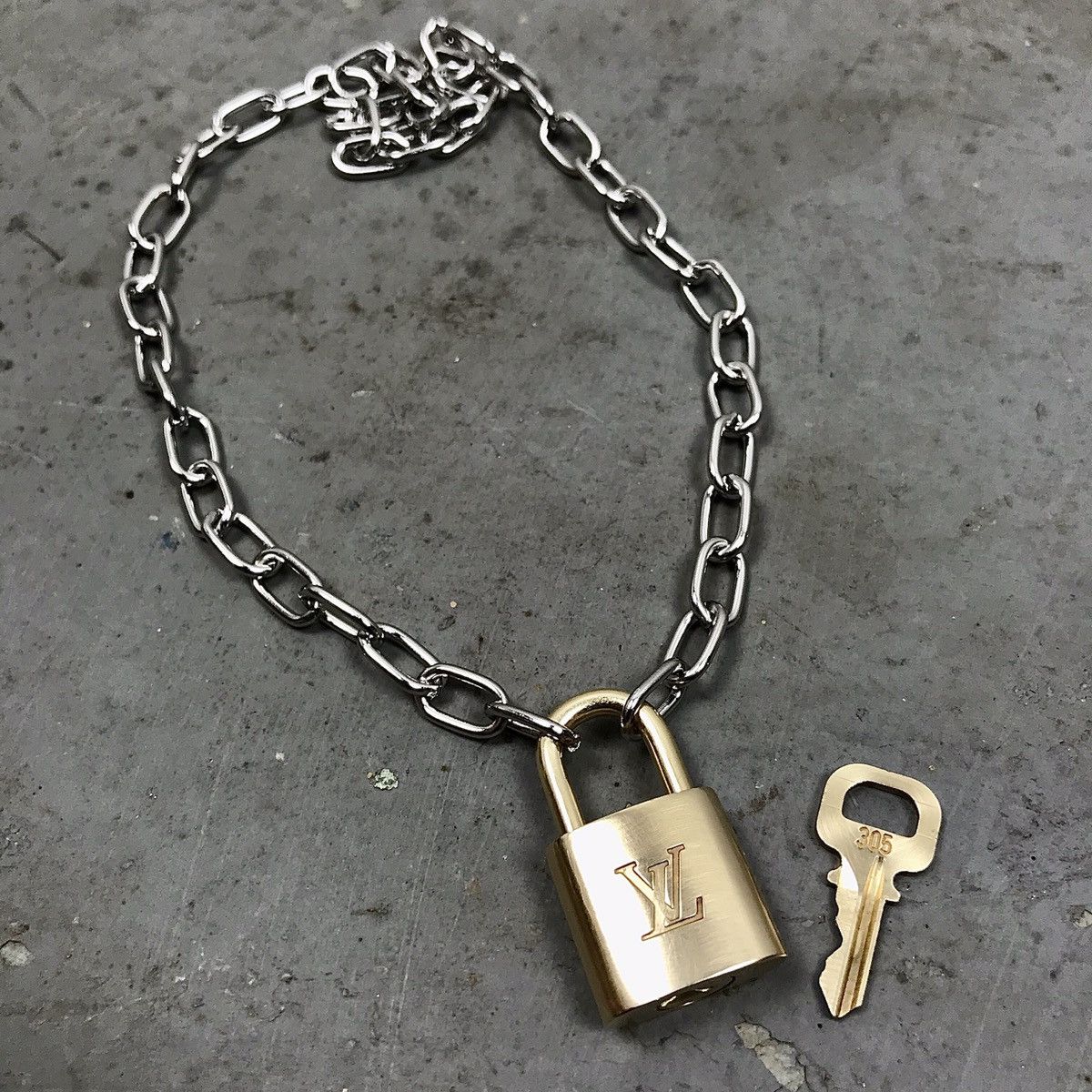 Louis Vuitton AUTHENTIC VINTAGE LOUIS VUITTON LOCK PENDANT | Grailed