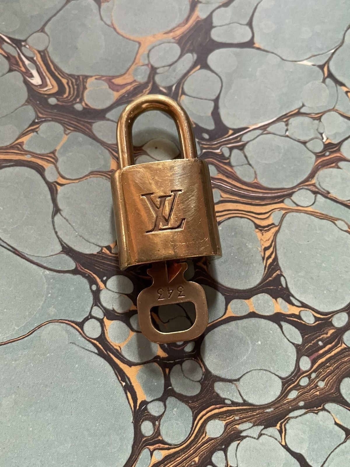 Louis Vuitton Louis Vuitton Lock | Grailed