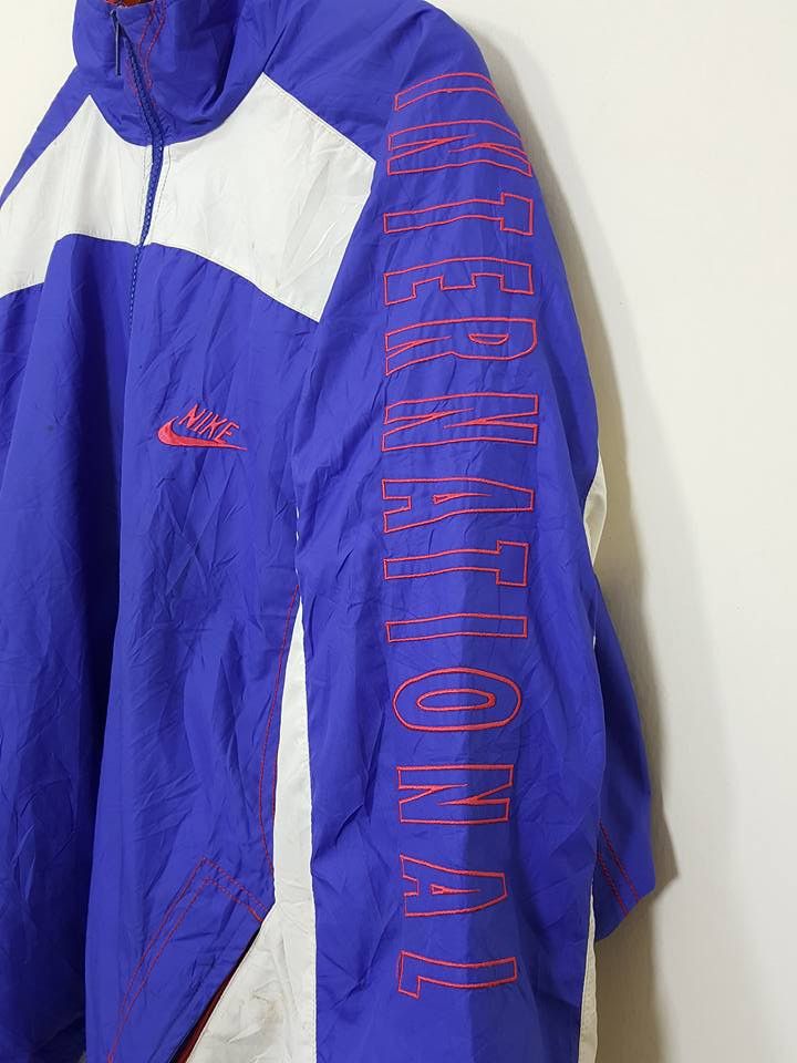 Nike Vtg. NIKE INTERNATIONAL 90's 'SAMPLE' Windbreaker Jacket | Grailed