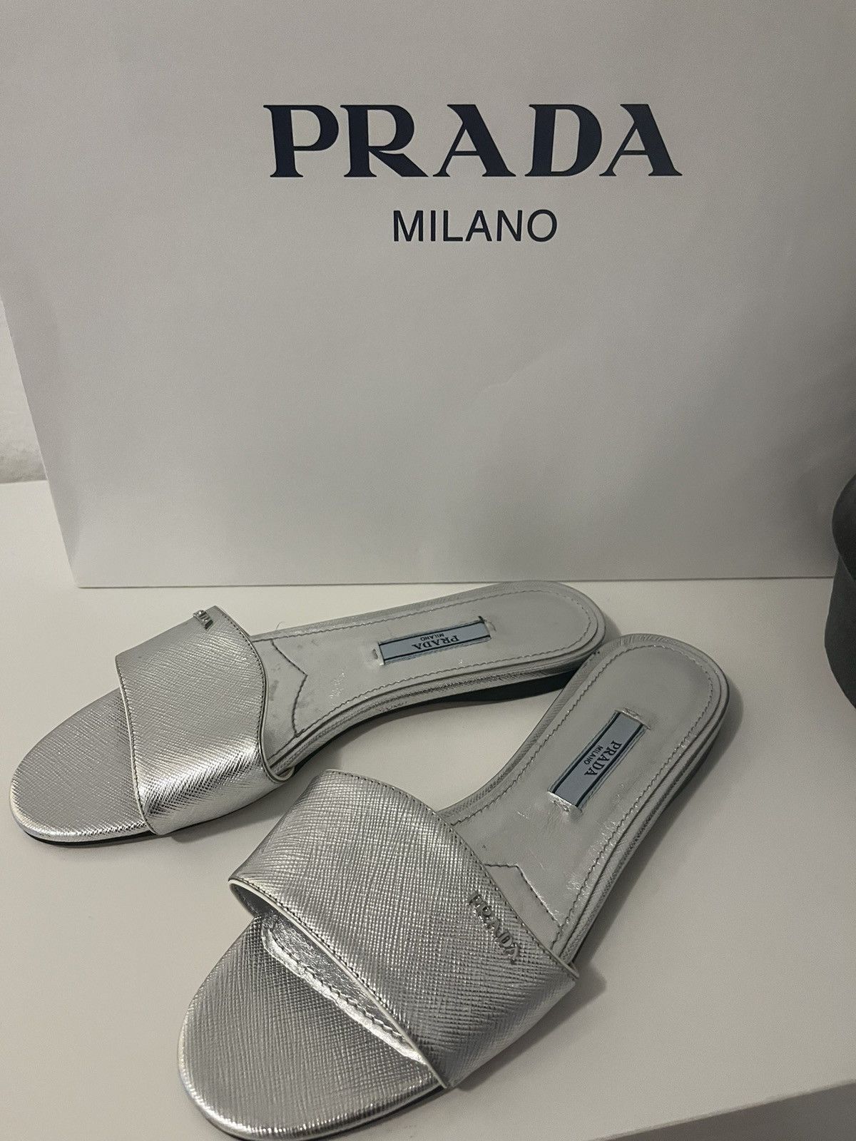 Prada Prada Silver Saffiano Metal Leather Logo Detail Slide Flats | Grailed