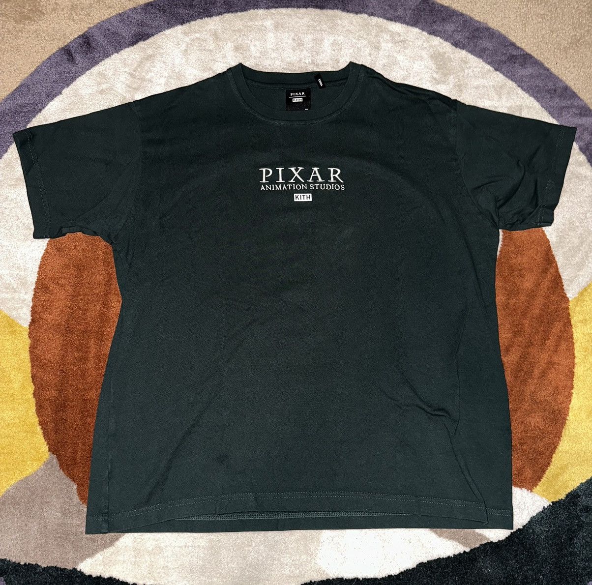 Disney × Kith × Ronnie Fieg Kith x Pixar Embroidered Logo T Shirt Forest Green Size XL | Grailed