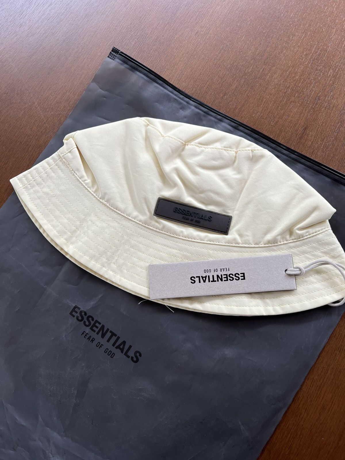 Fear of God Essentials Fear of God Bucket Hat FW22 Canary | Grailed