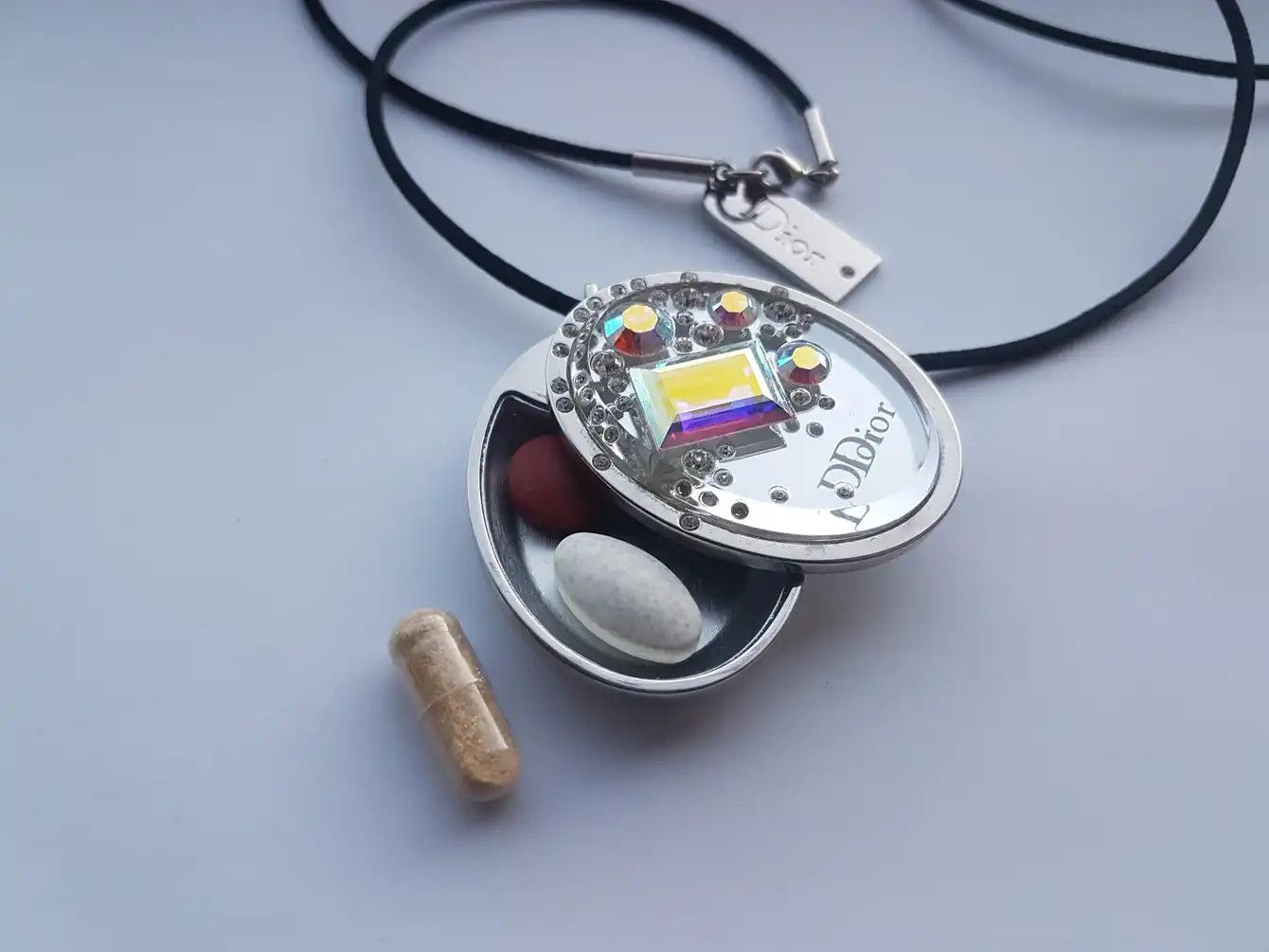 Dior × Swarovski Dior pill chamber pendant | Grailed