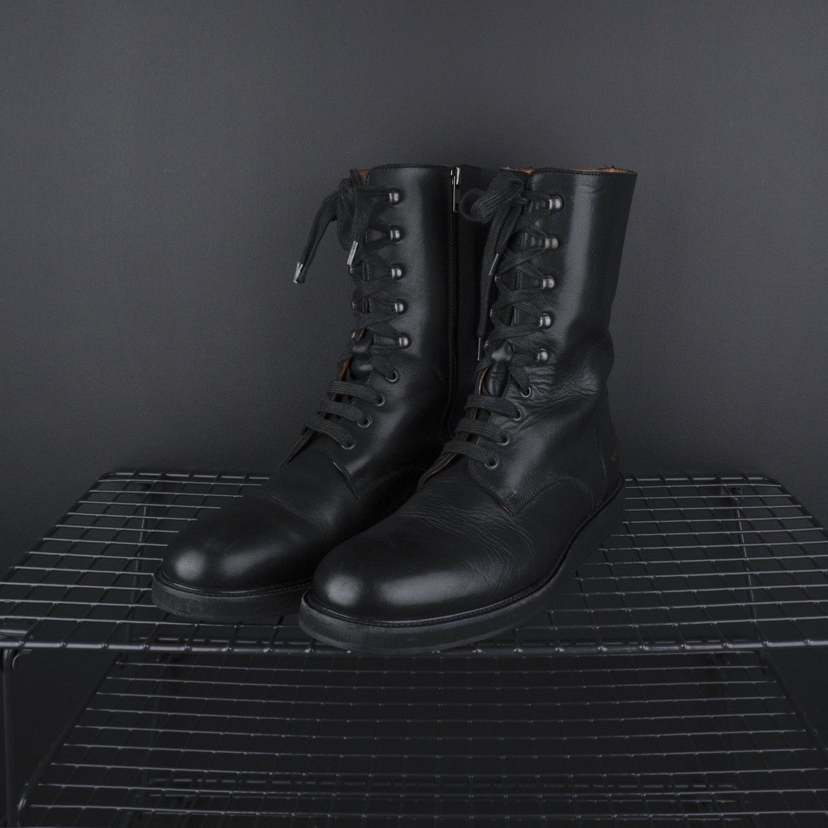 Common Projects Common projects combat logo black leather boots | Grailed