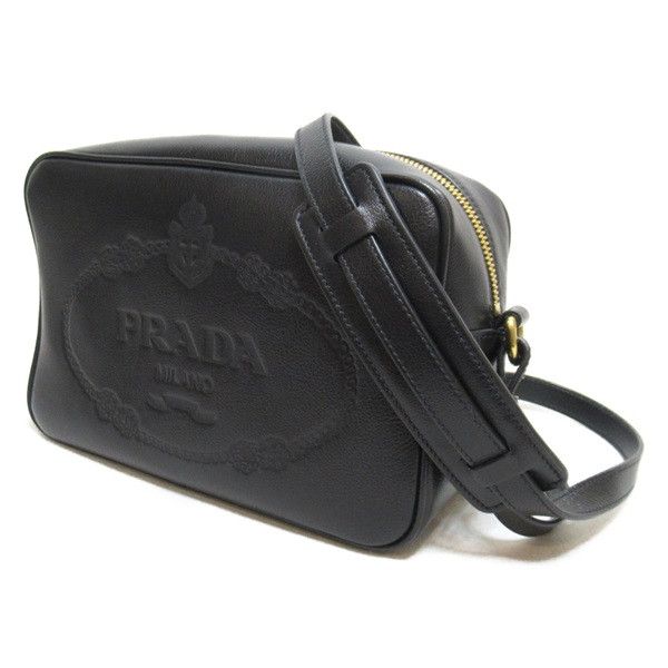 Prada Prada Leather Logo Embossed Camera Bag | Grailed