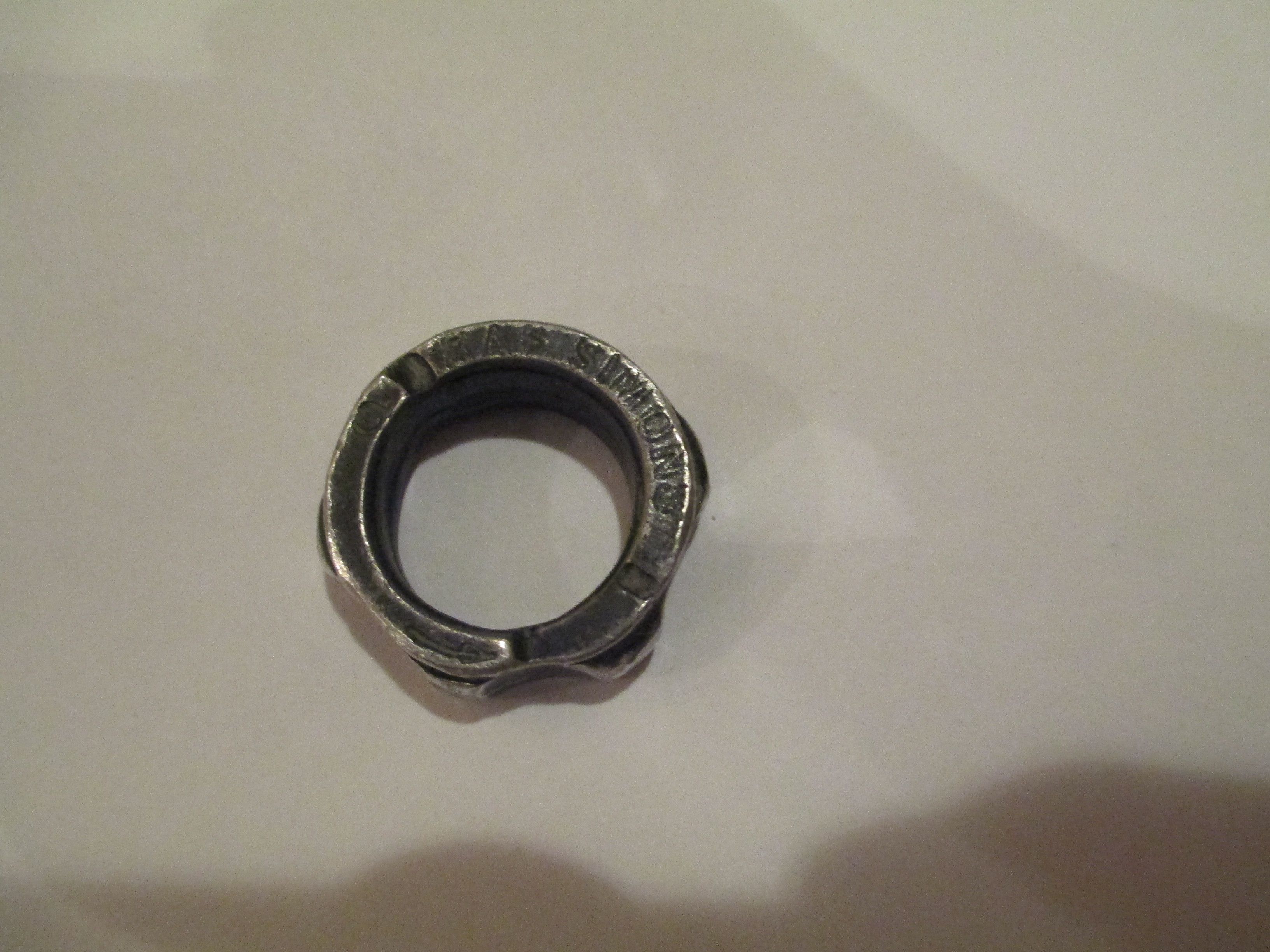 Raf Simons SS03 Consumed ring made of metal waste | Grailed