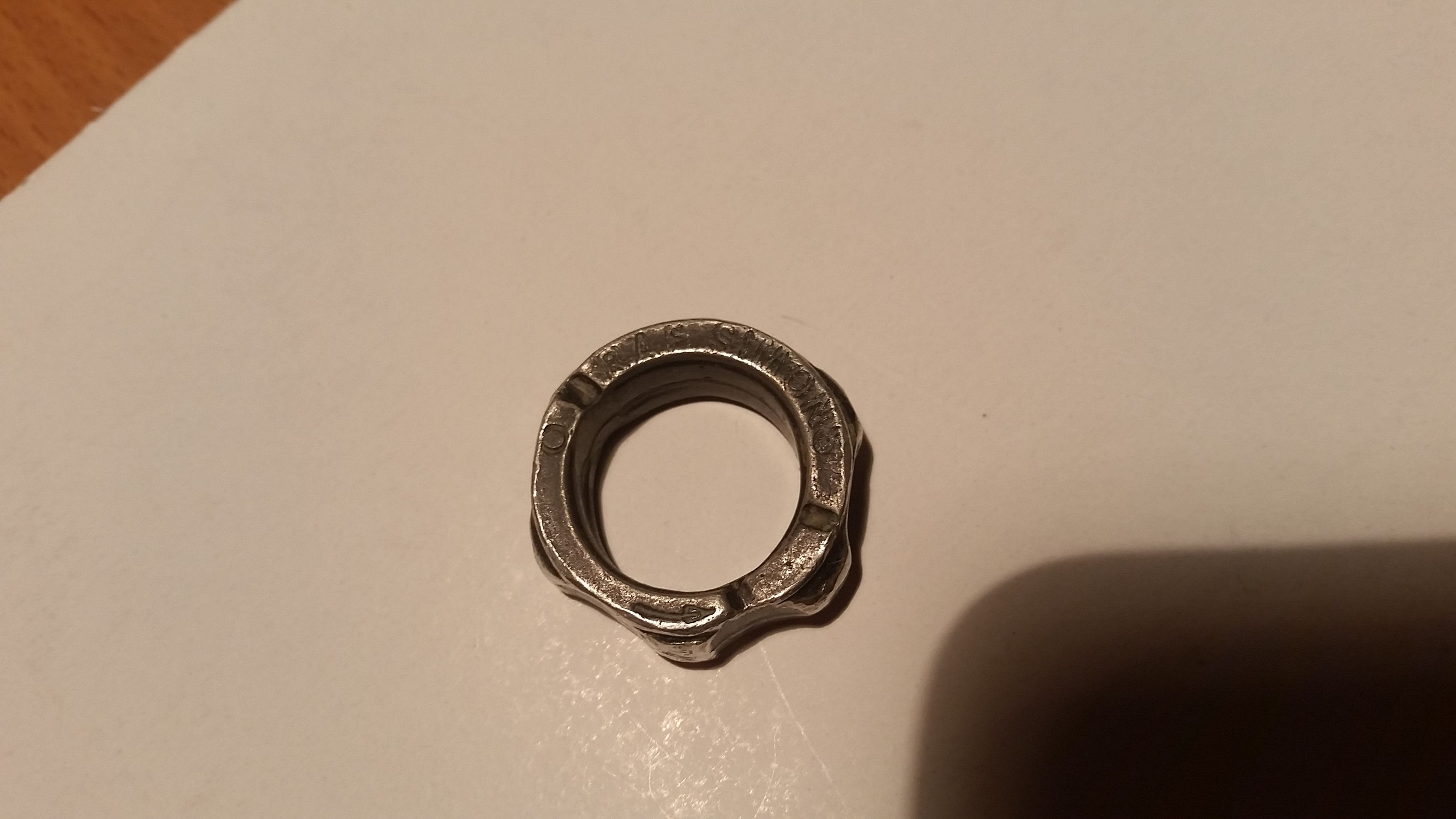 Raf Simons SS03 Consumed ring made of metal waste | Grailed