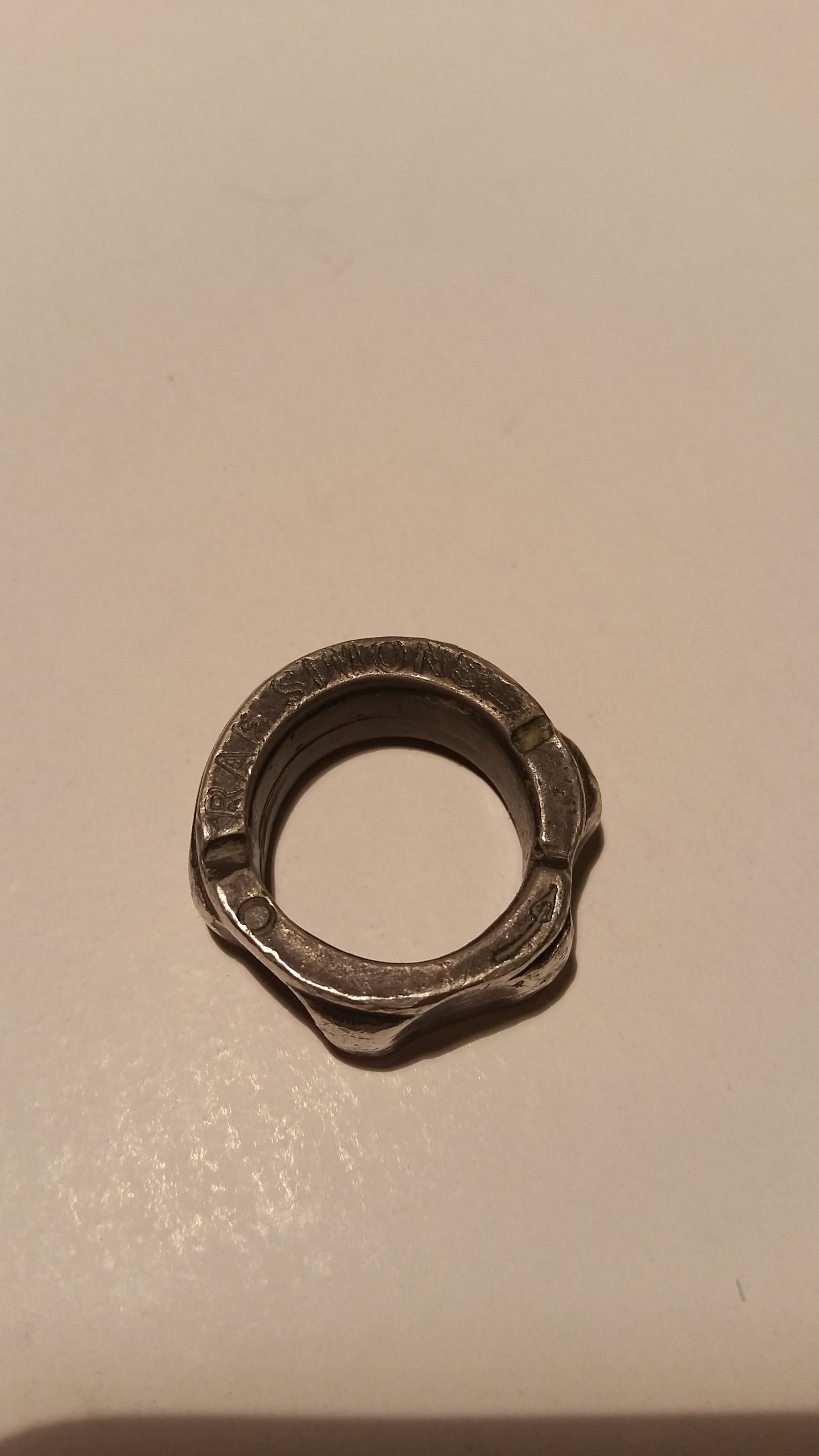 Raf Simons SS03 Consumed ring made of metal waste | Grailed