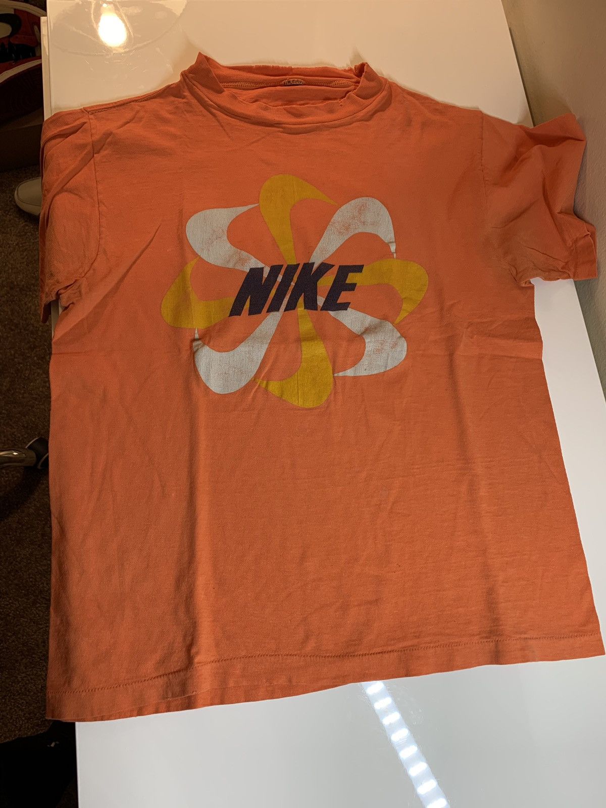 Nike VINTAGE ORIGINAL 1970's NIKE BLOCK LETTER ORANGE PINWHEEL | Grailed