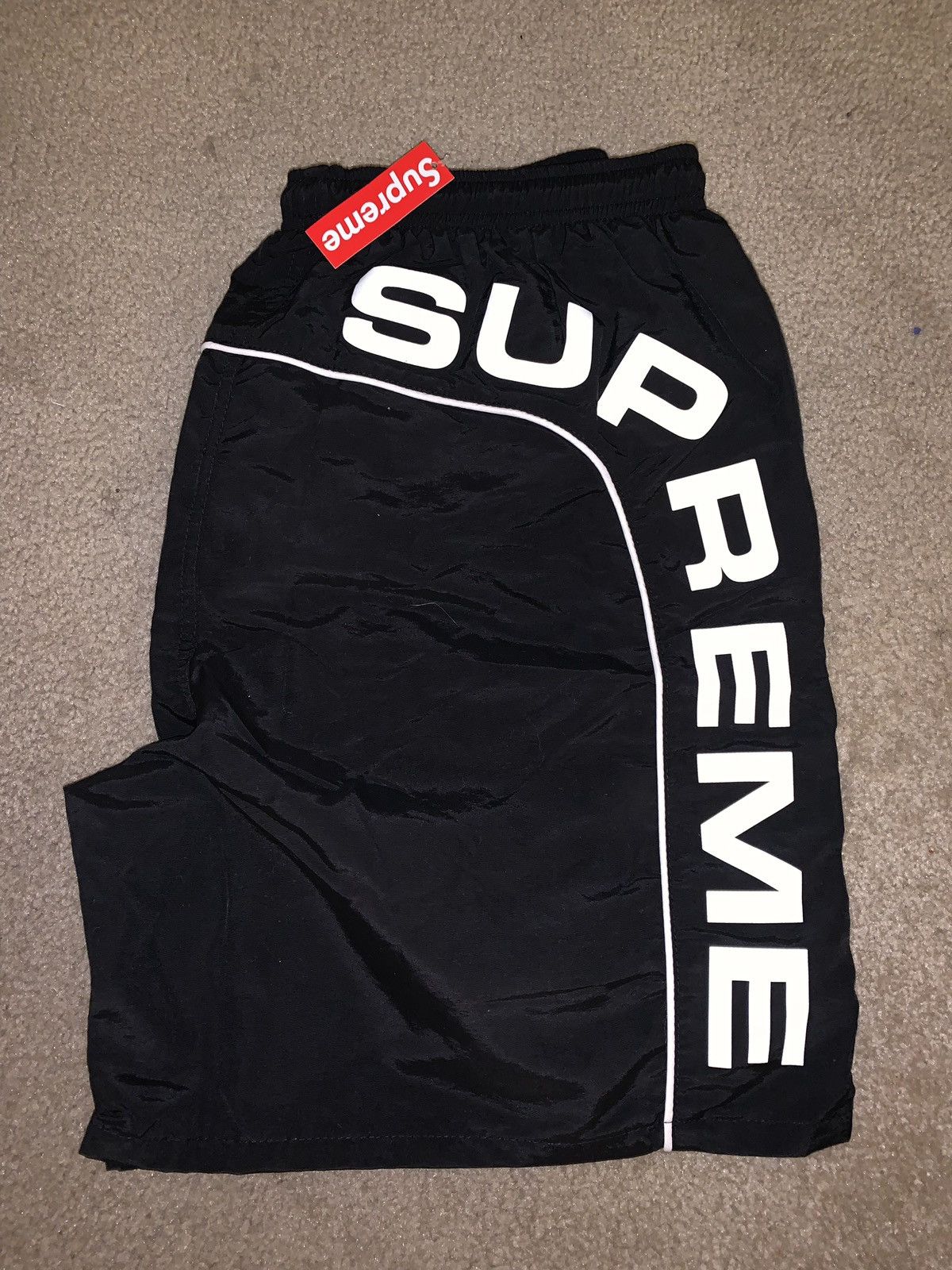 Supreme Supreme arch logo swim shorts | Grailed
