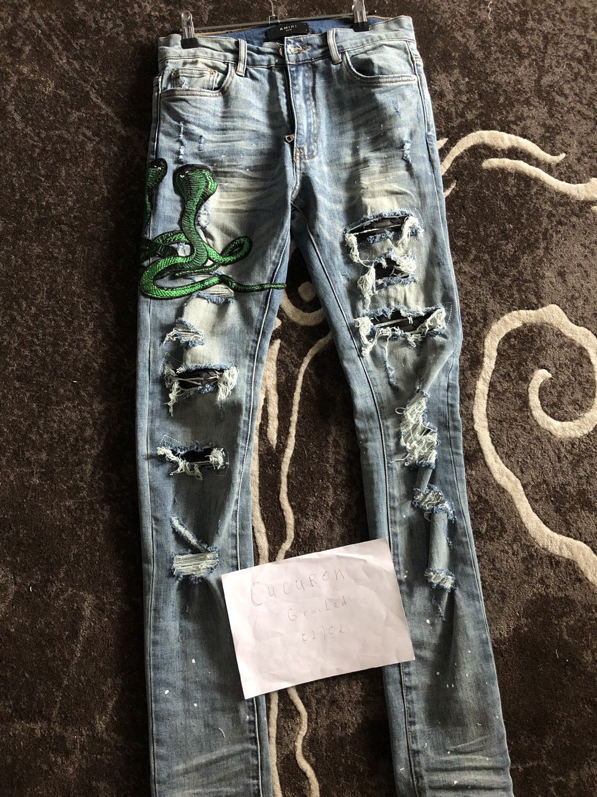 Amiri Amiri Destroyed Snake Patch jeans | Grailed