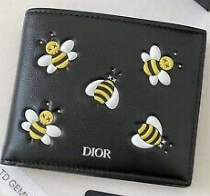Dior × Kaws Dior KAWS black leather bi-fold Bee wallet | Grailed