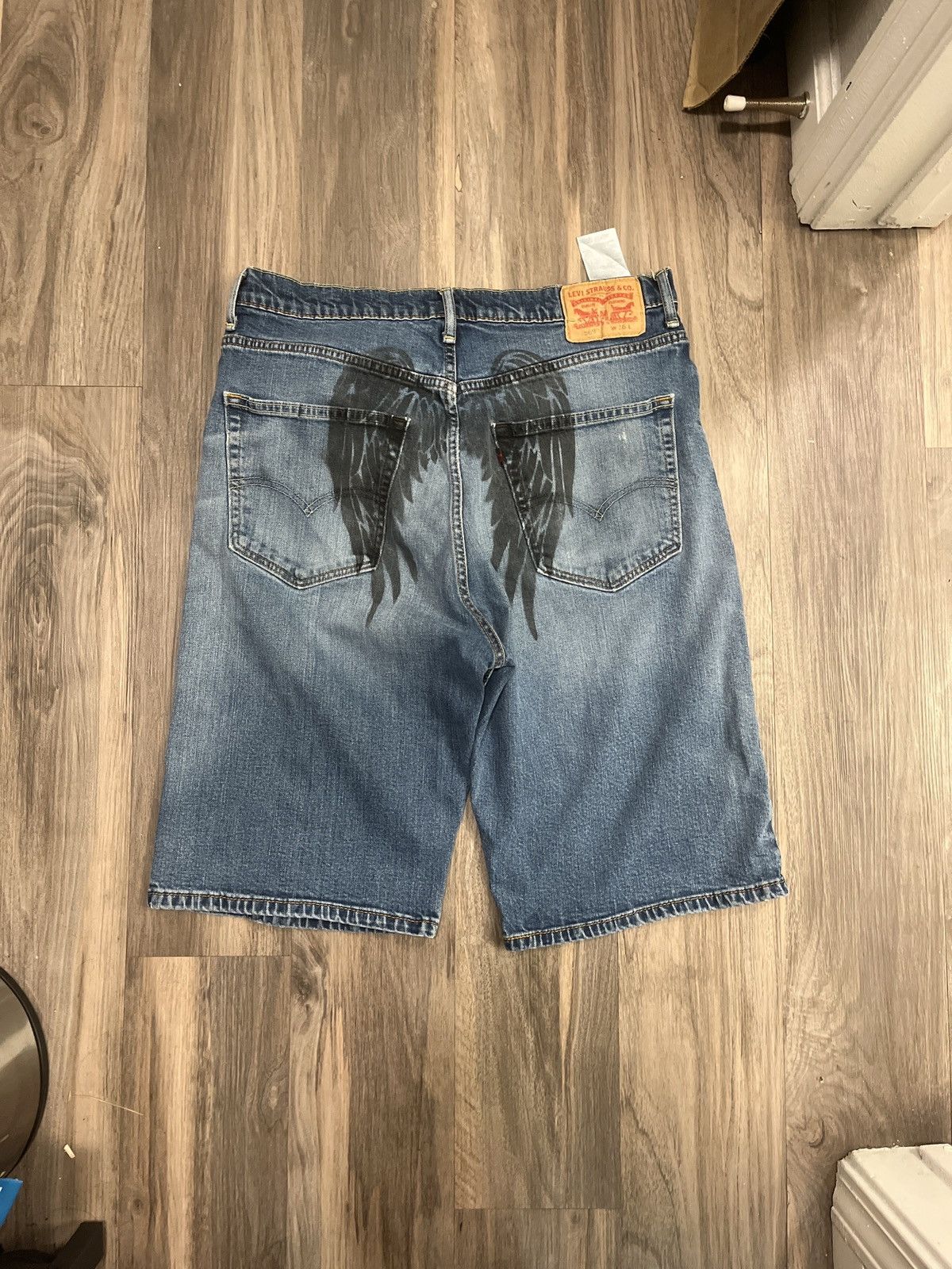 Levi's Vintage Levis jorts size 36 with angel wings design | Grailed
