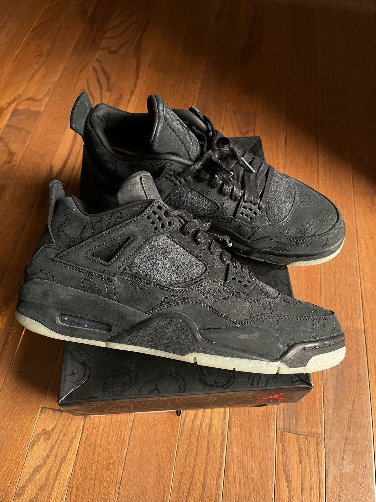 Jordan Brand × Kaws × Nike KAWS 4s in black | Grailed