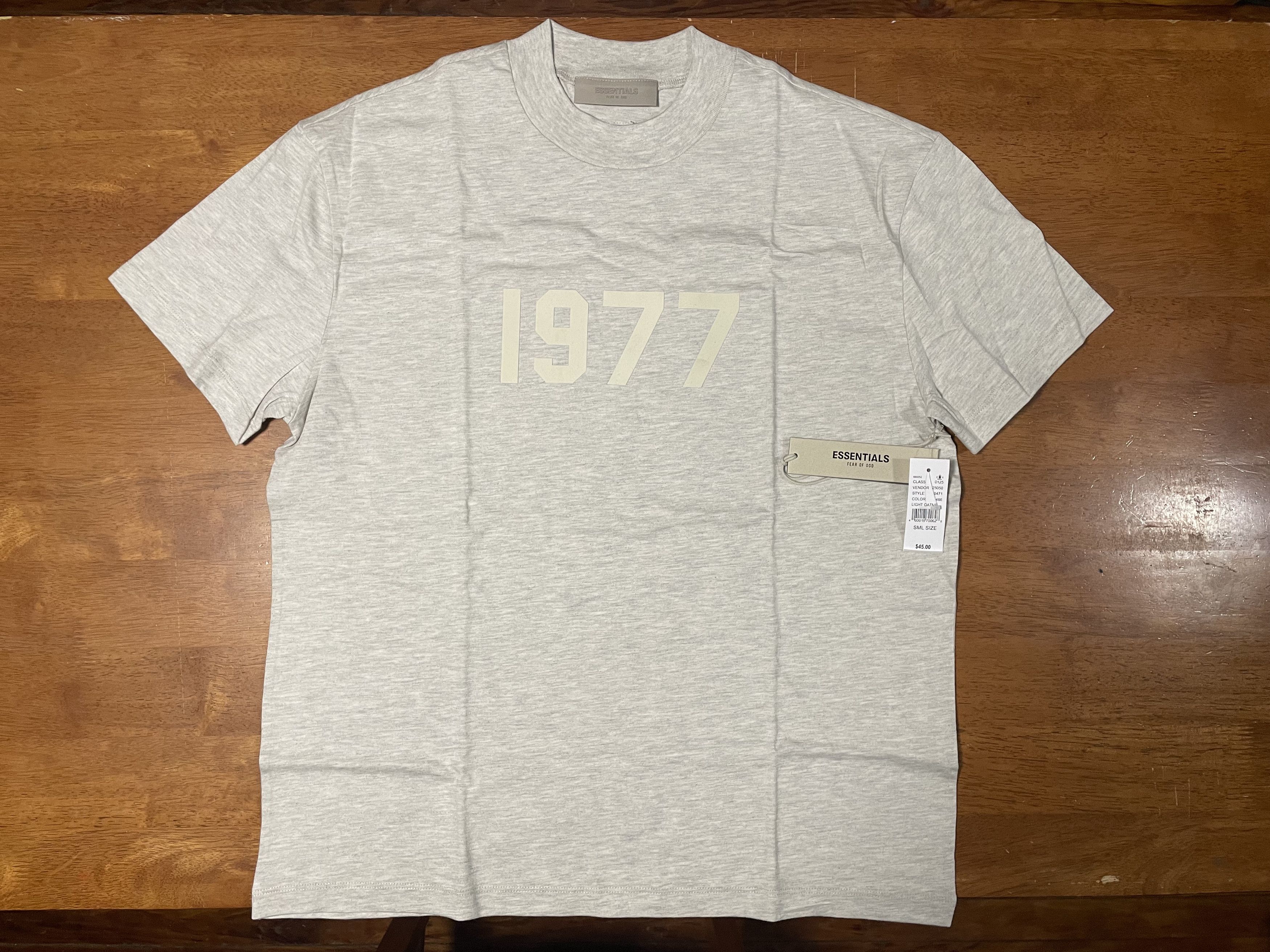 Fear of God Fear of god Essentials 1977 T-shirt Light Oatmeal | Grailed