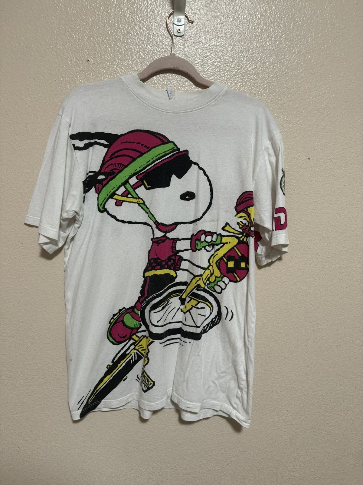 Peanuts × Streetwear × Vintage AOP Vintage Snoopy racing tee | Grailed