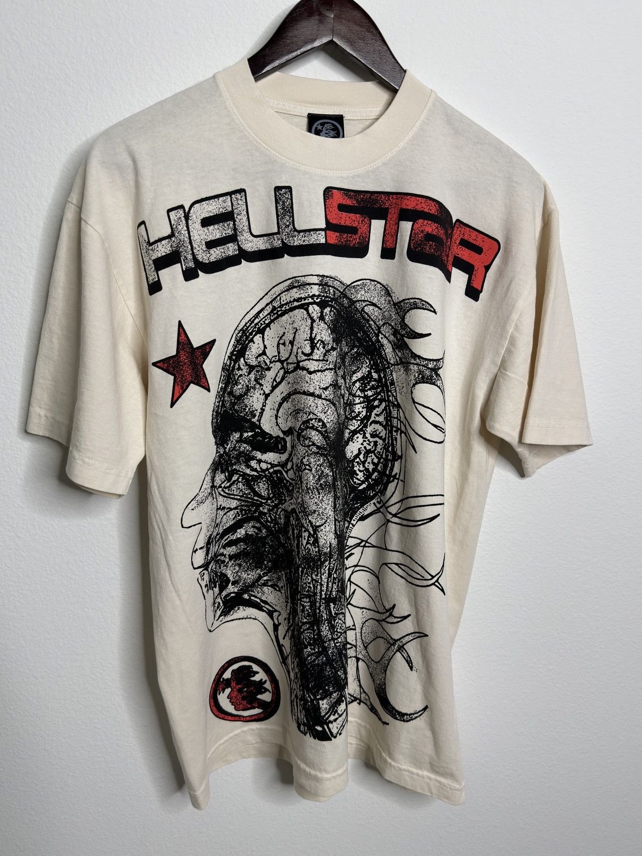 HELLSTAR Hellstar Studios Human Development Tee Cream | Grailed