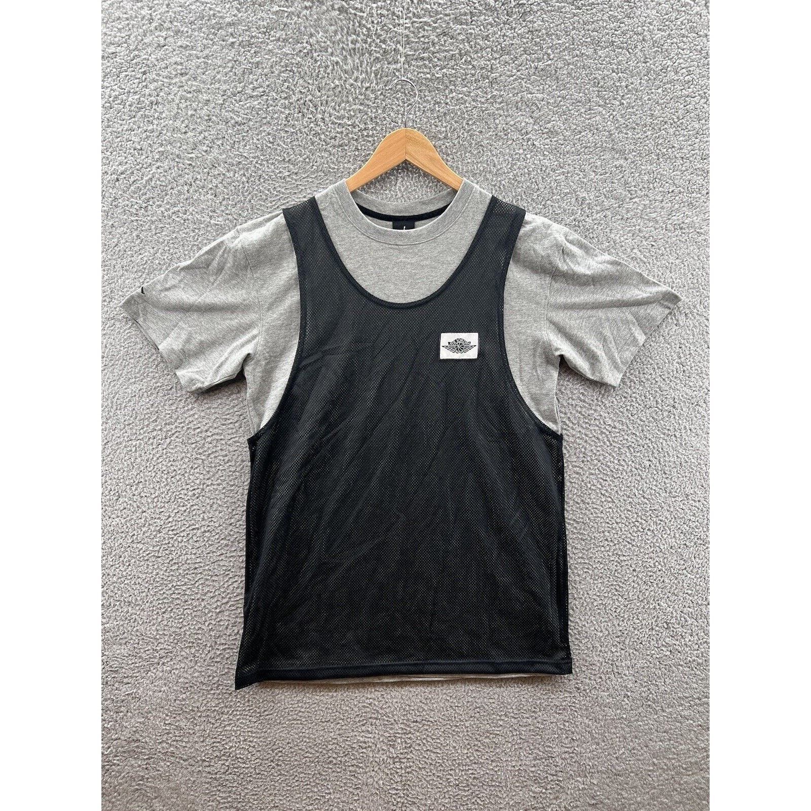 Jordan Brand Jordan Wings Logo Mesh Jersey Layered Over A Gray T-Shirt ...