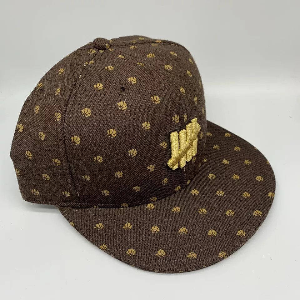 New Era × Undefeated Undefeated Mocha Gold 7 1/4 59Fifty New Era Hat ...