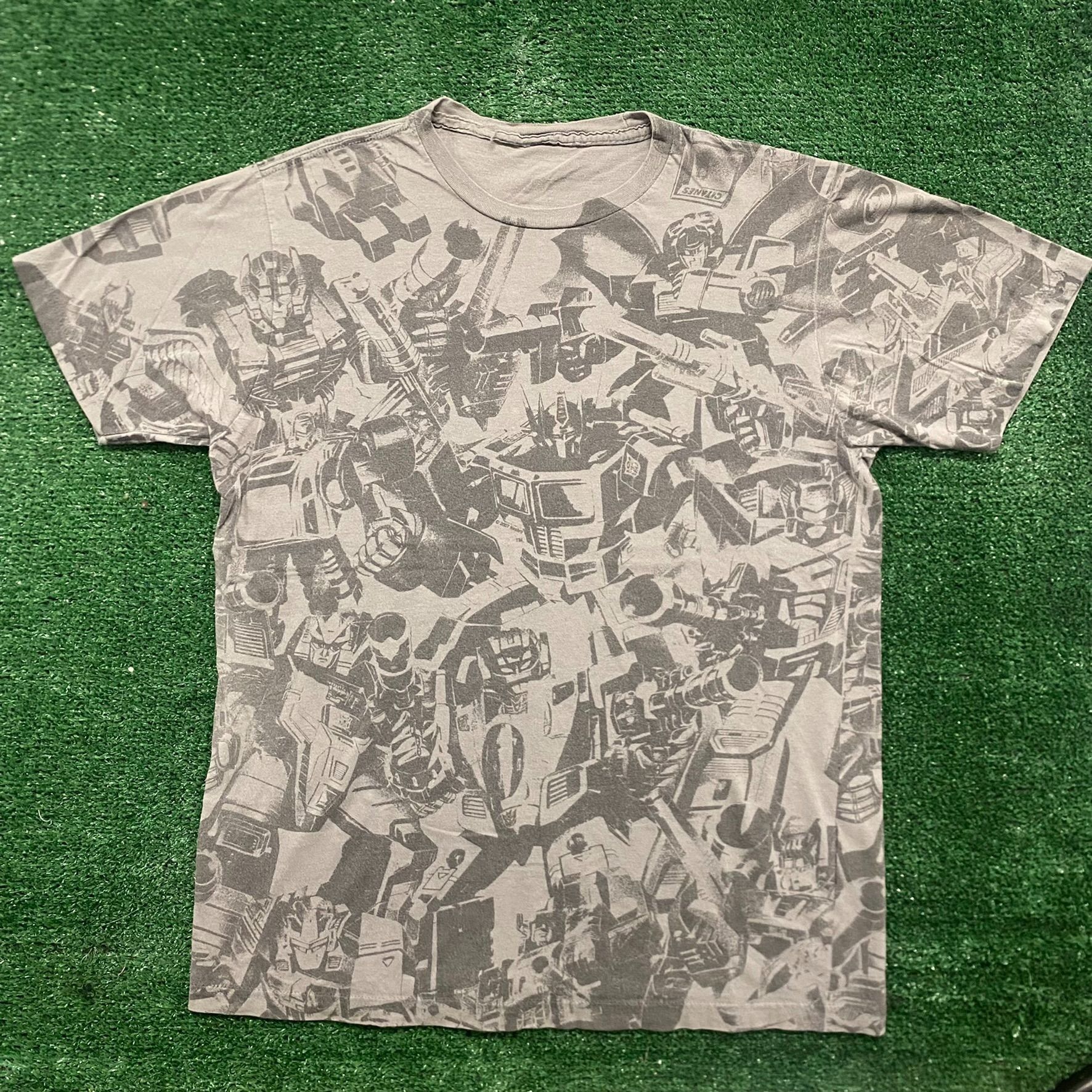 Vintage Vintage Y2K Transformers Robots AOP Cartoon Essential Tee | Grailed
