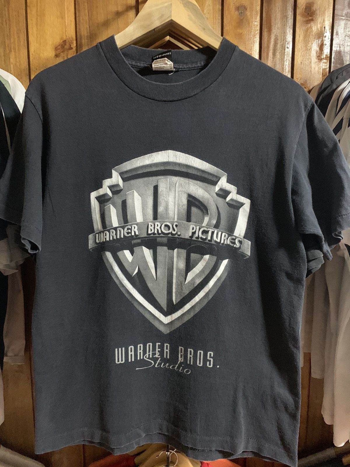 Warner Bros “VINTAGE” (RARE) WARNER BROS. STUDIO LOGO TEE | Grailed