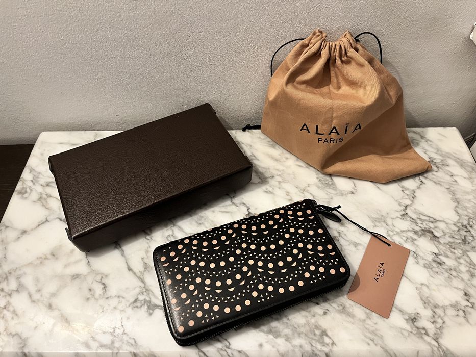 Alaia NEW Alaïa zipped companion wallet in black and sand leather | Grailed