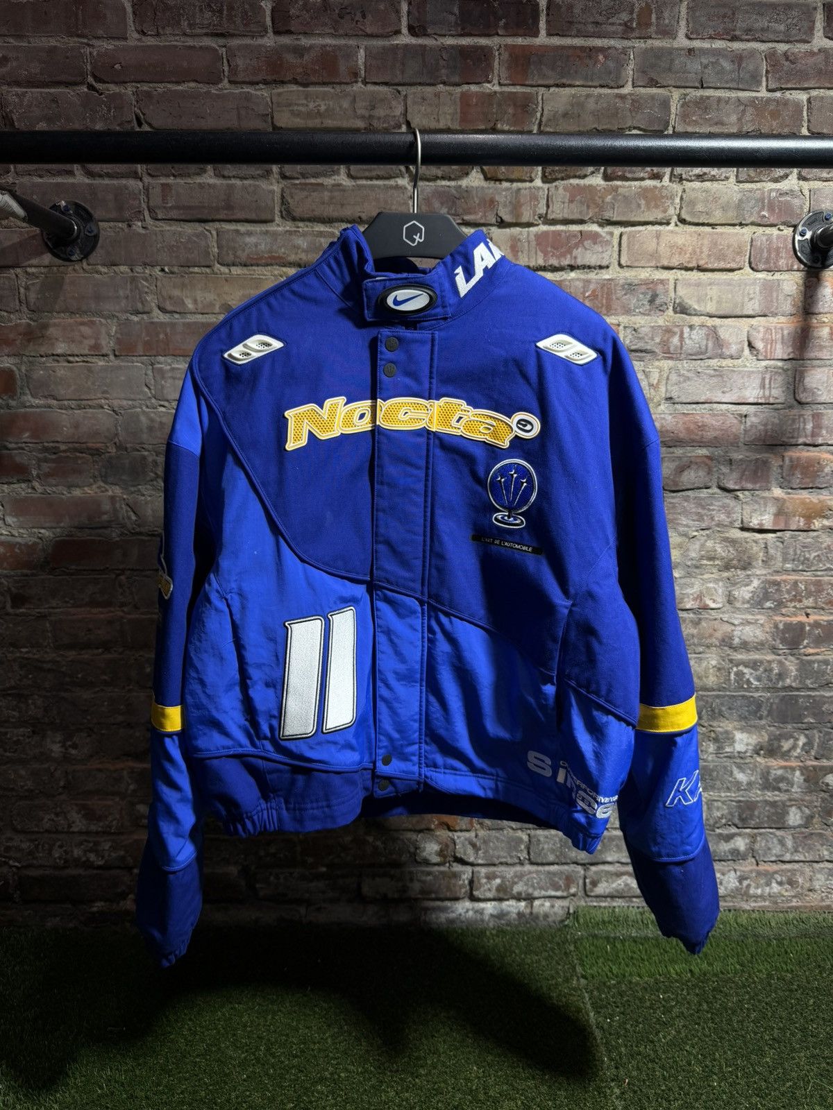 NOCTA × Nike Nike x Nocta L’Art Racing Jacket | Grailed