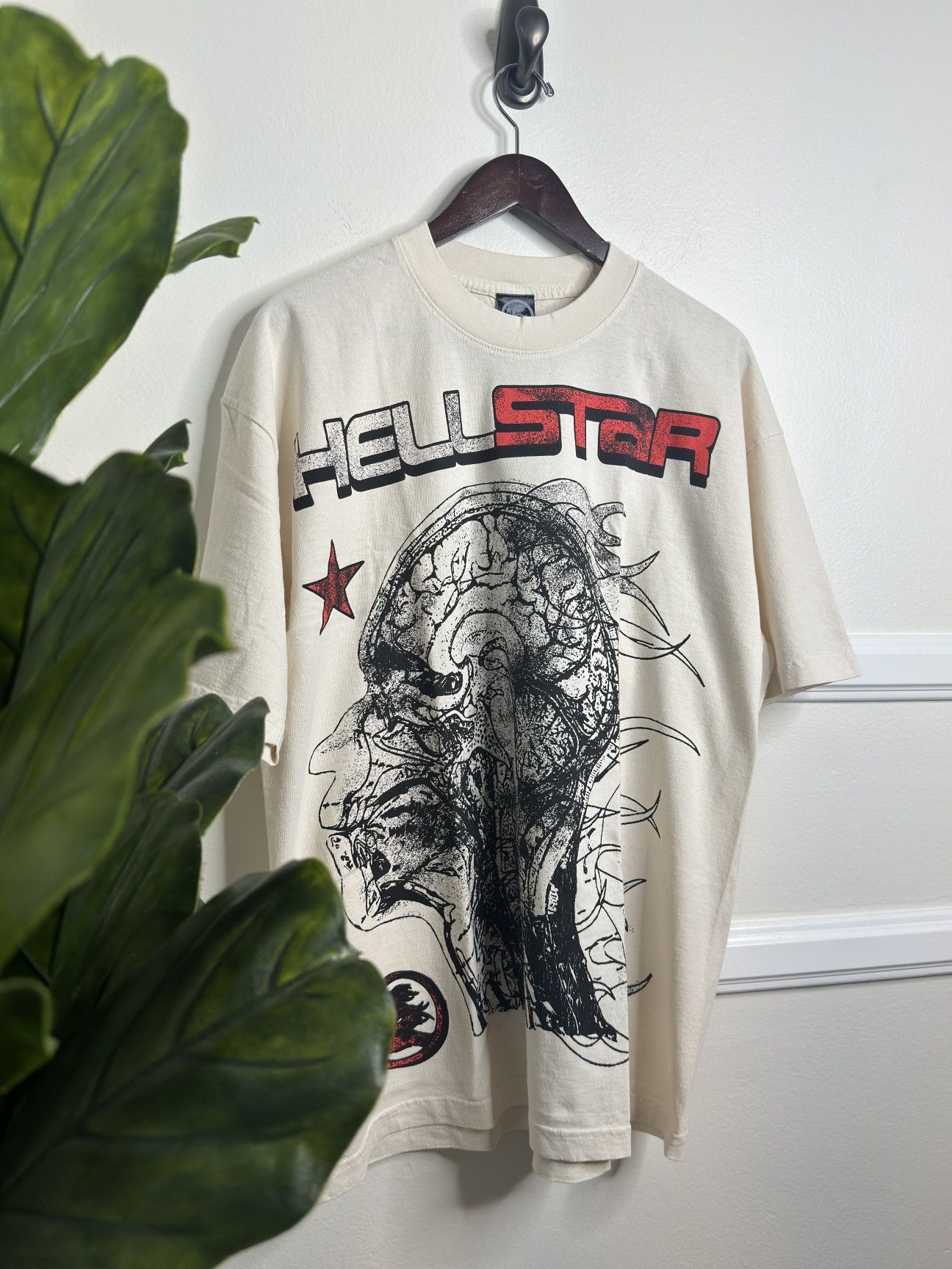 HELLSTAR Hellstar Studios Human Development Tee Cream | Grailed