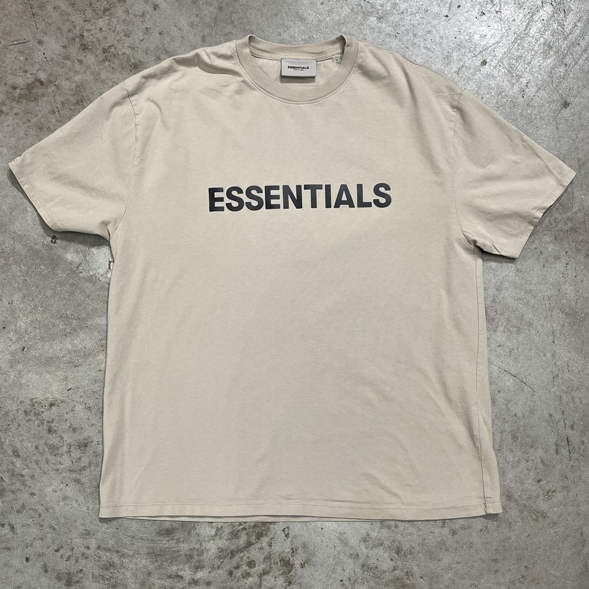 Fear of God ESSENTIALS fear of god black logo on tan | Grailed