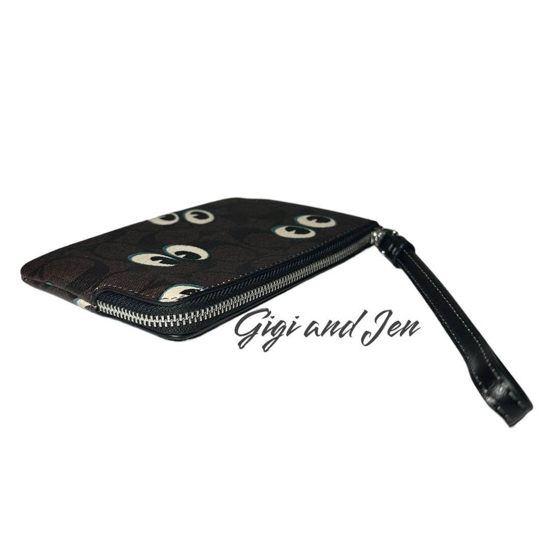 Coach Coach Corner Zip Wristlet In Signature Canvas Halloween Eyes ...