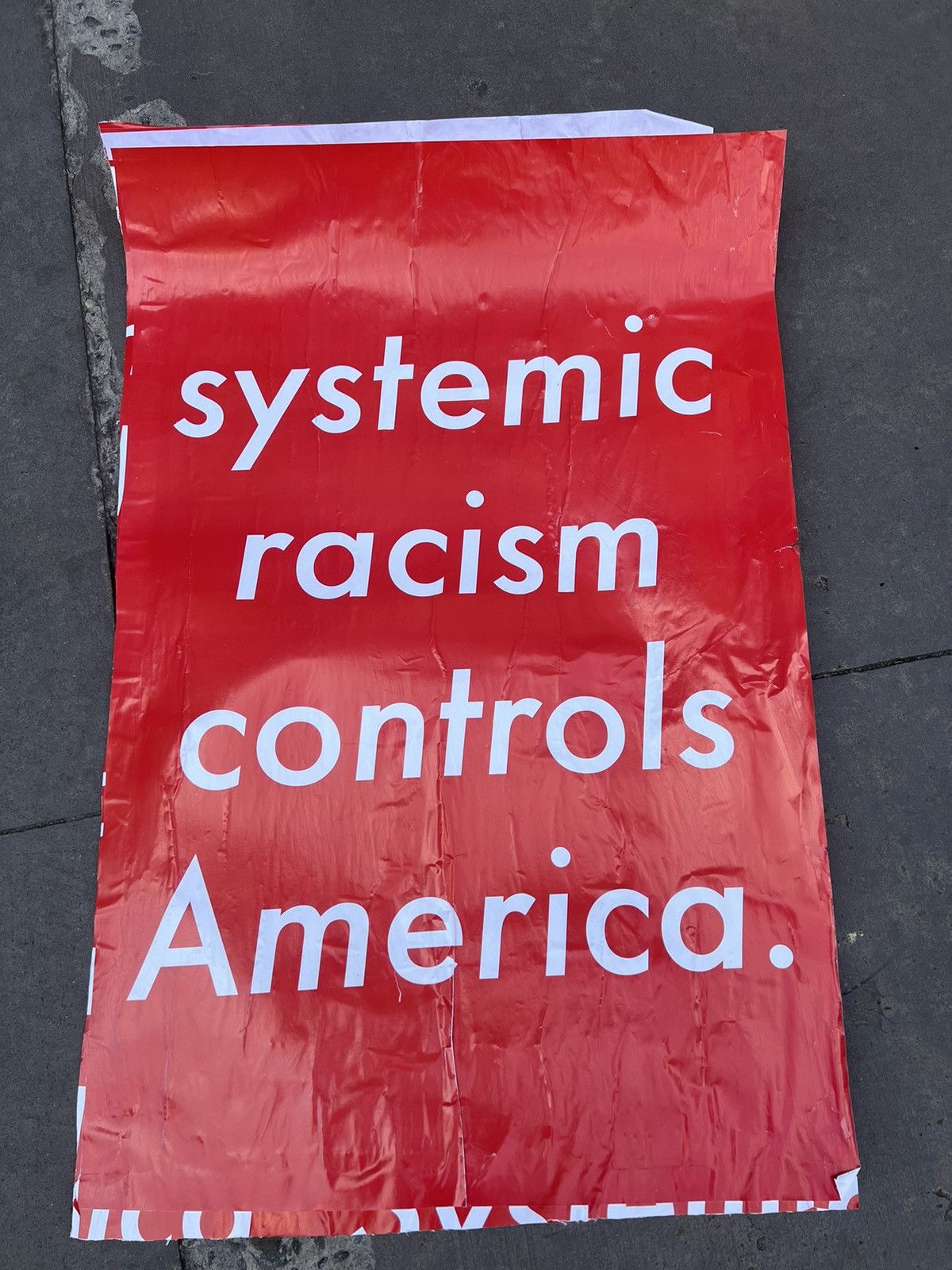 DENIM TEARS Systemic racism controls America poster | Grailed