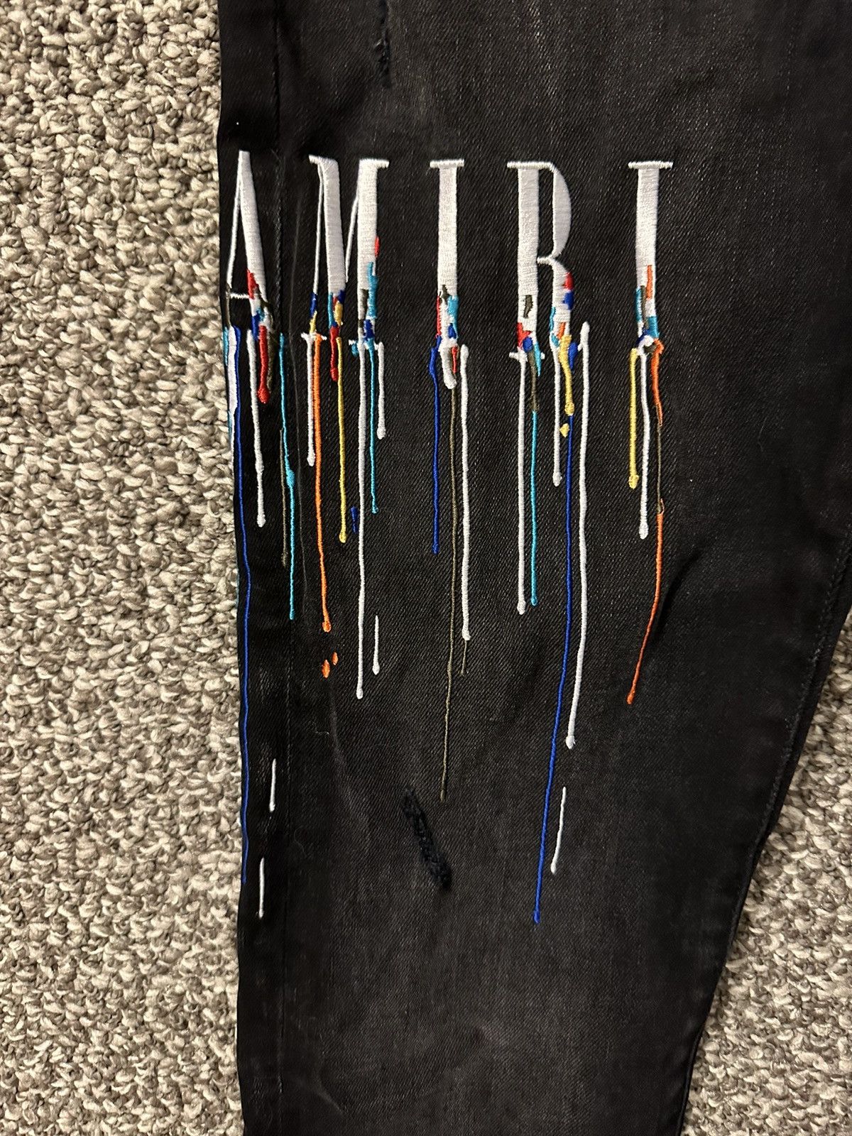 Amiri Amiri Embroidered Paint Drip Core Logo Distressed Jeans | Grailed