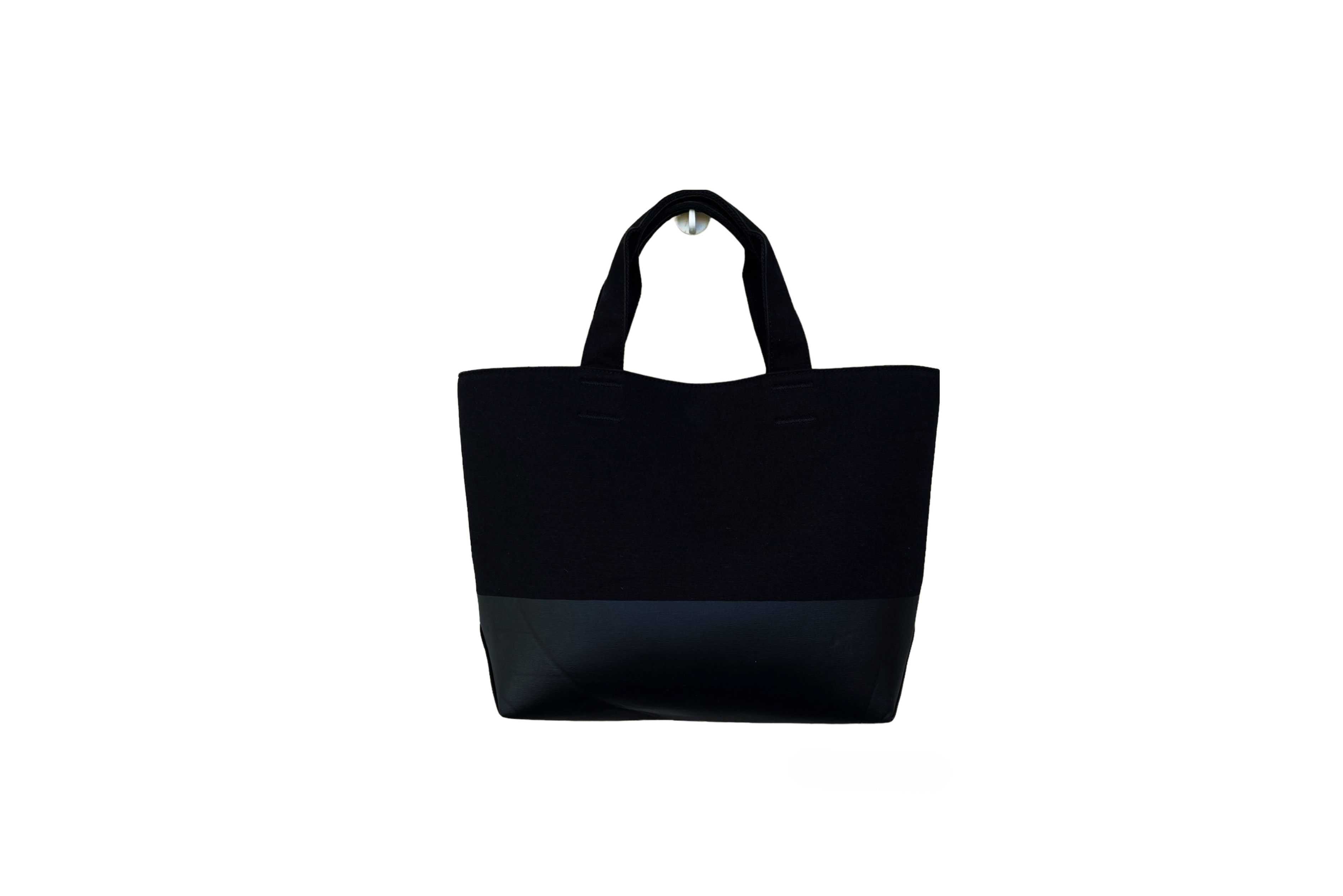 Uniqlo Uniqlo plain black handbag with dipping details | Grailed