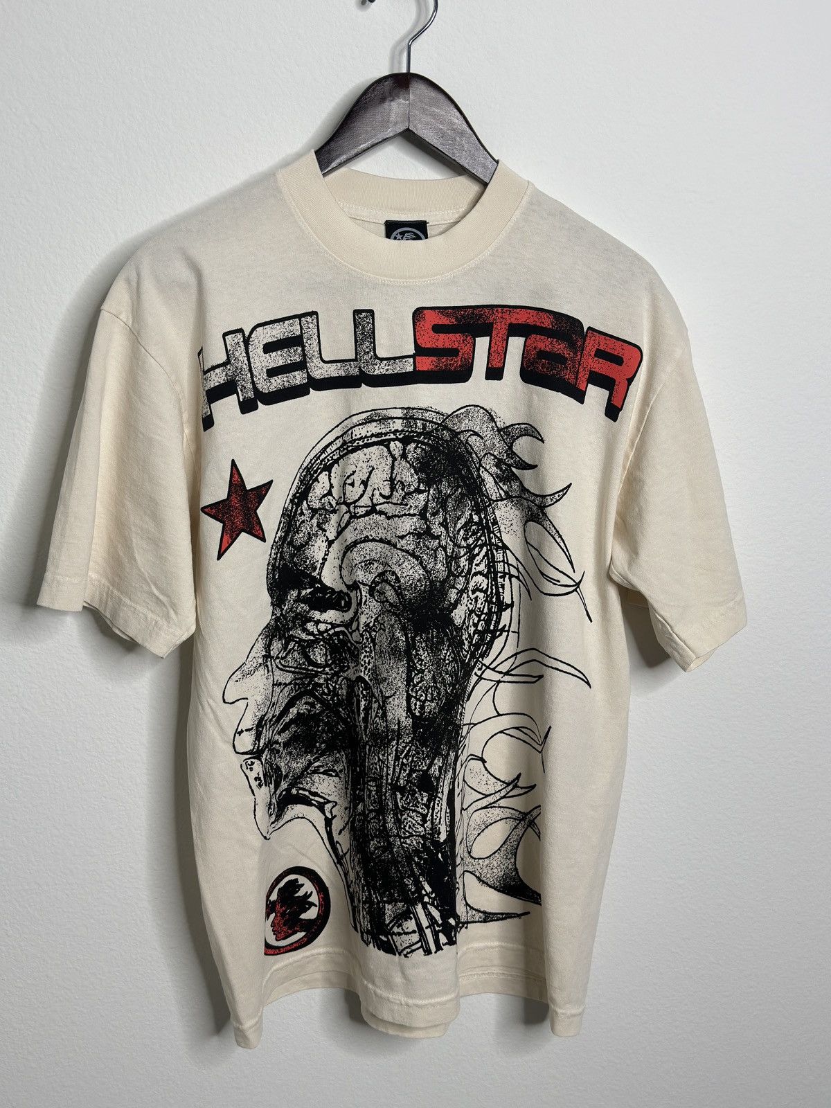 HELLSTAR Hellstar Studios Human Development Tee Cream | Grailed