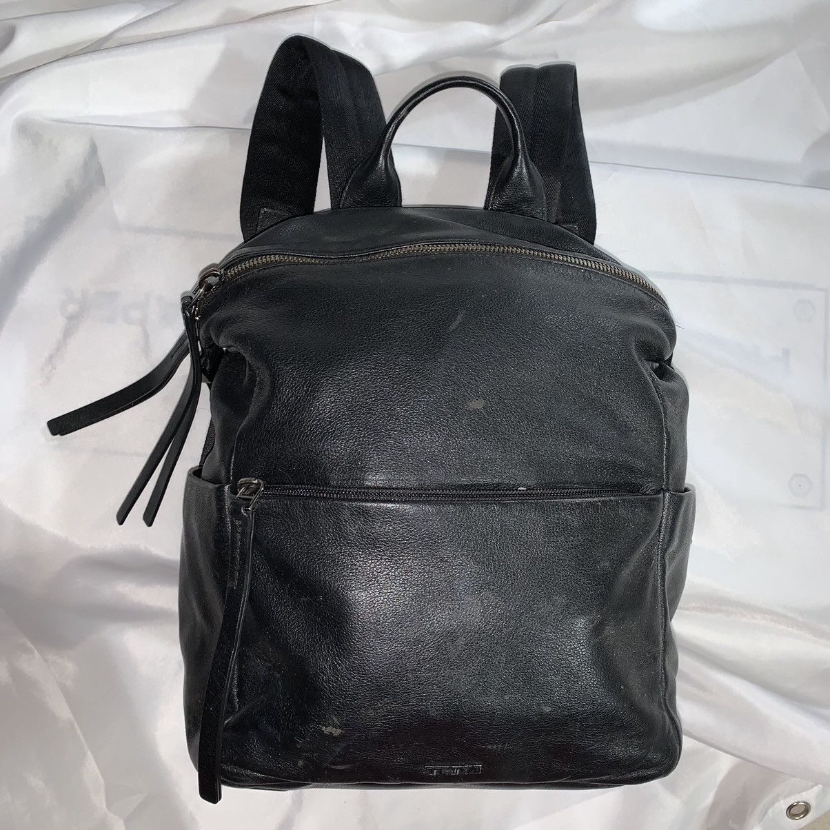 Tumi TUMI small black leather BACKPACK | Grailed
