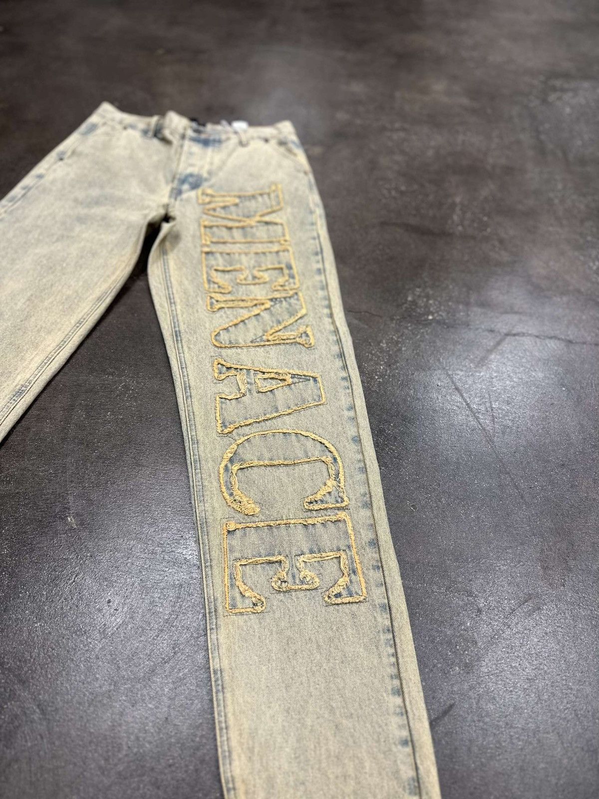 Menace DISTRESSED STENCIL DENIM PANTS | Grailed