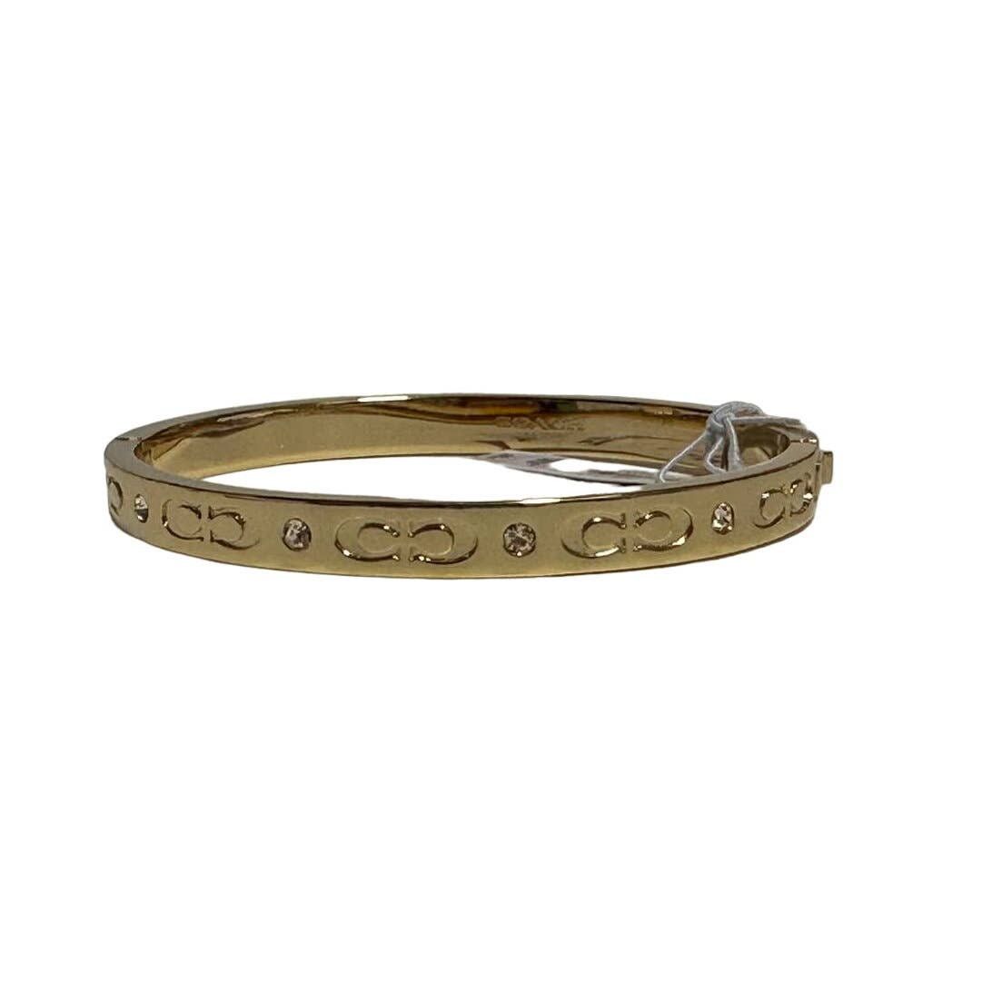 Coach Coach Gold tone Kissing C Hinged Bangle Bracelet | Grailed