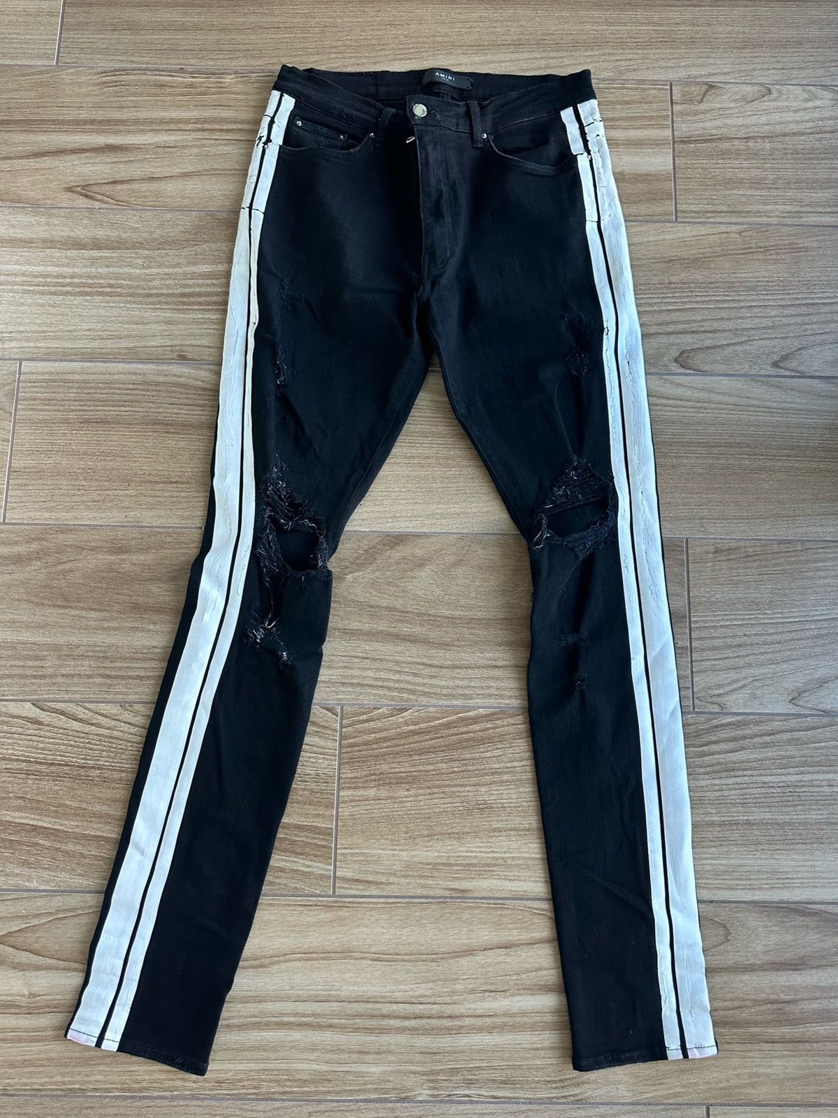 Amiri Amiri Black Track Jeans with Painted White Stripe | Grailed