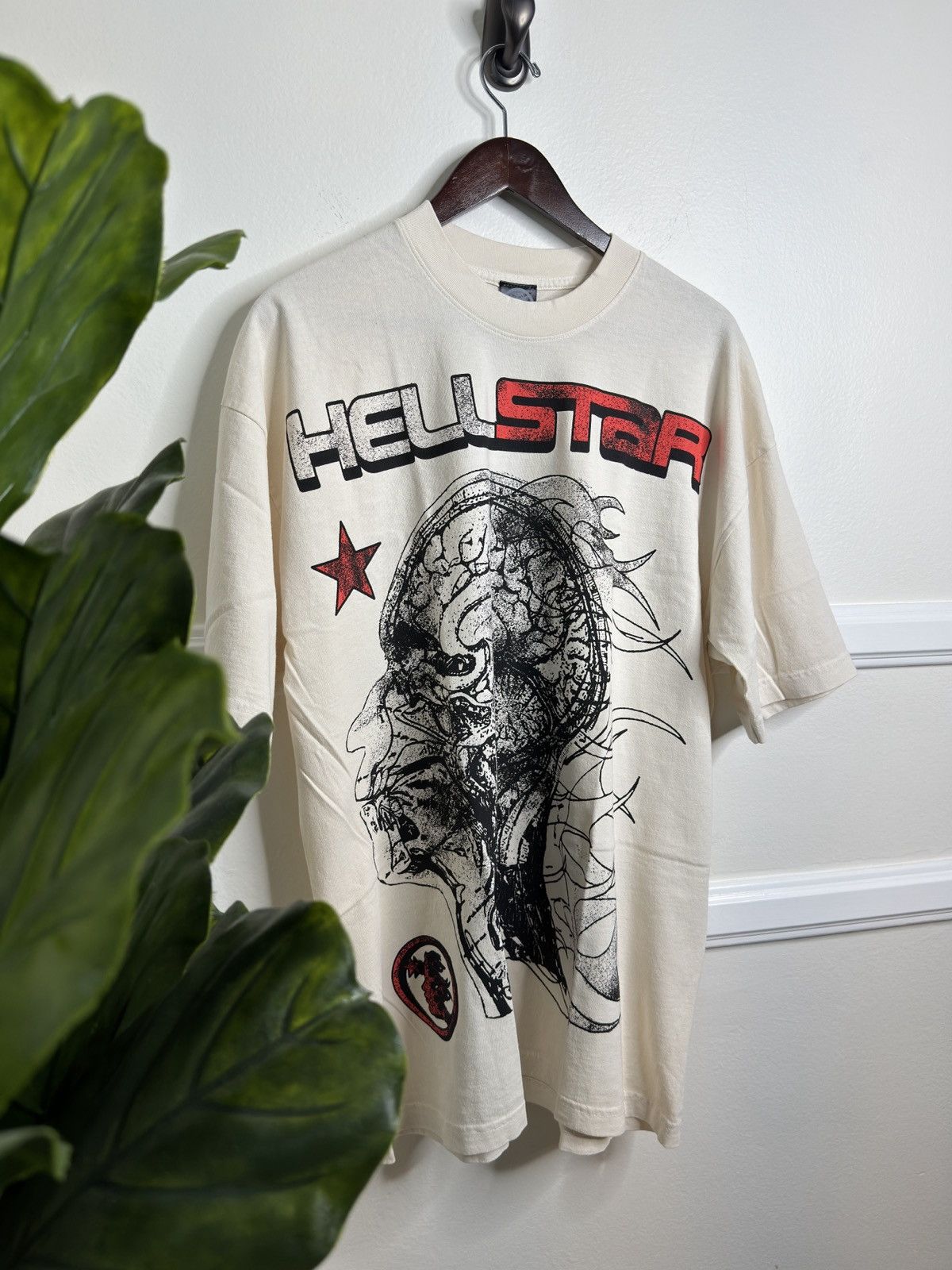 HELLSTAR Hellstar Studios Human Development Tee Cream | Grailed